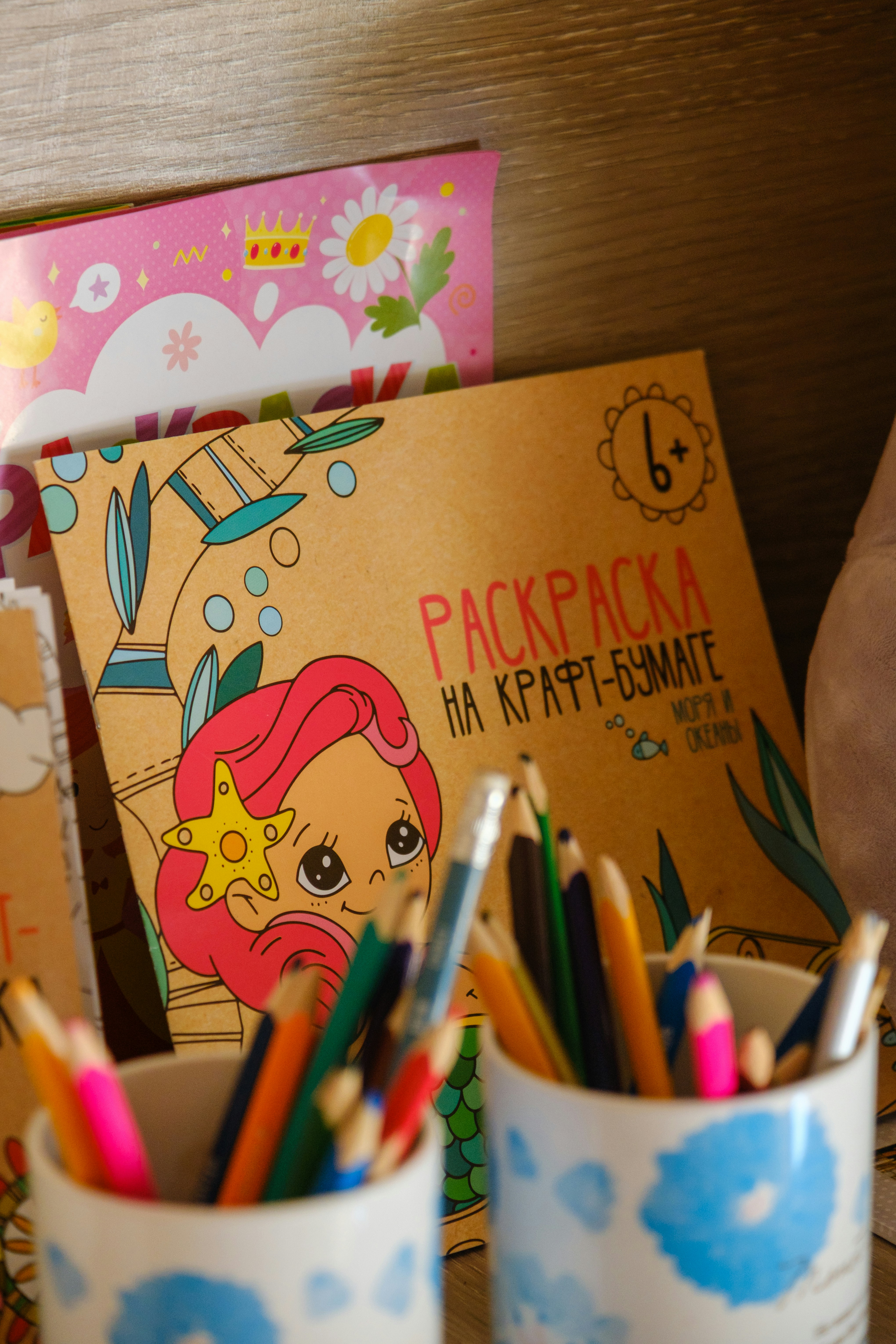 Colorful Craft Books and Pencils: A Shelf of Whimsy