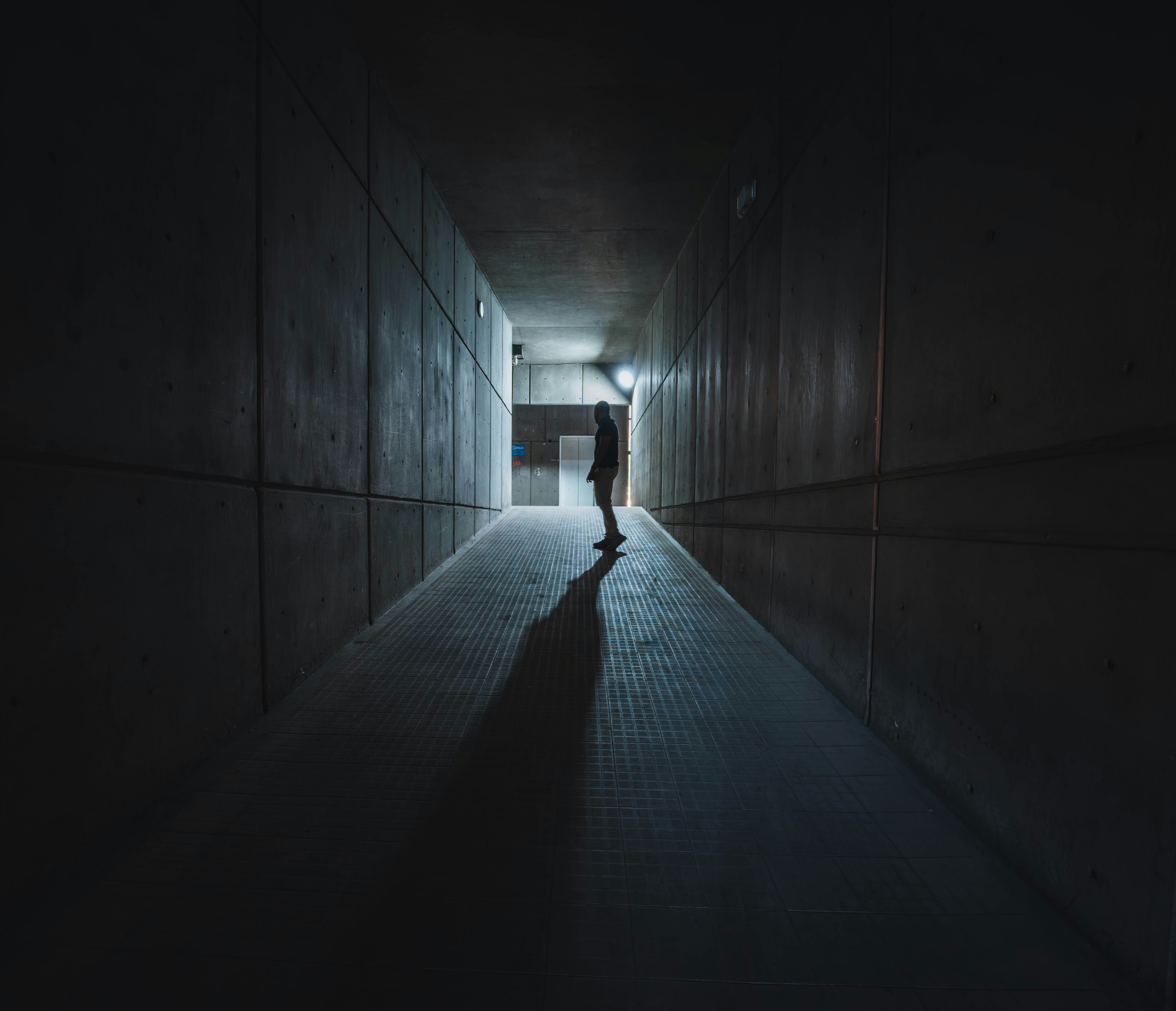Silhouette in the Neon Hall: A Quiet Edge of Escape