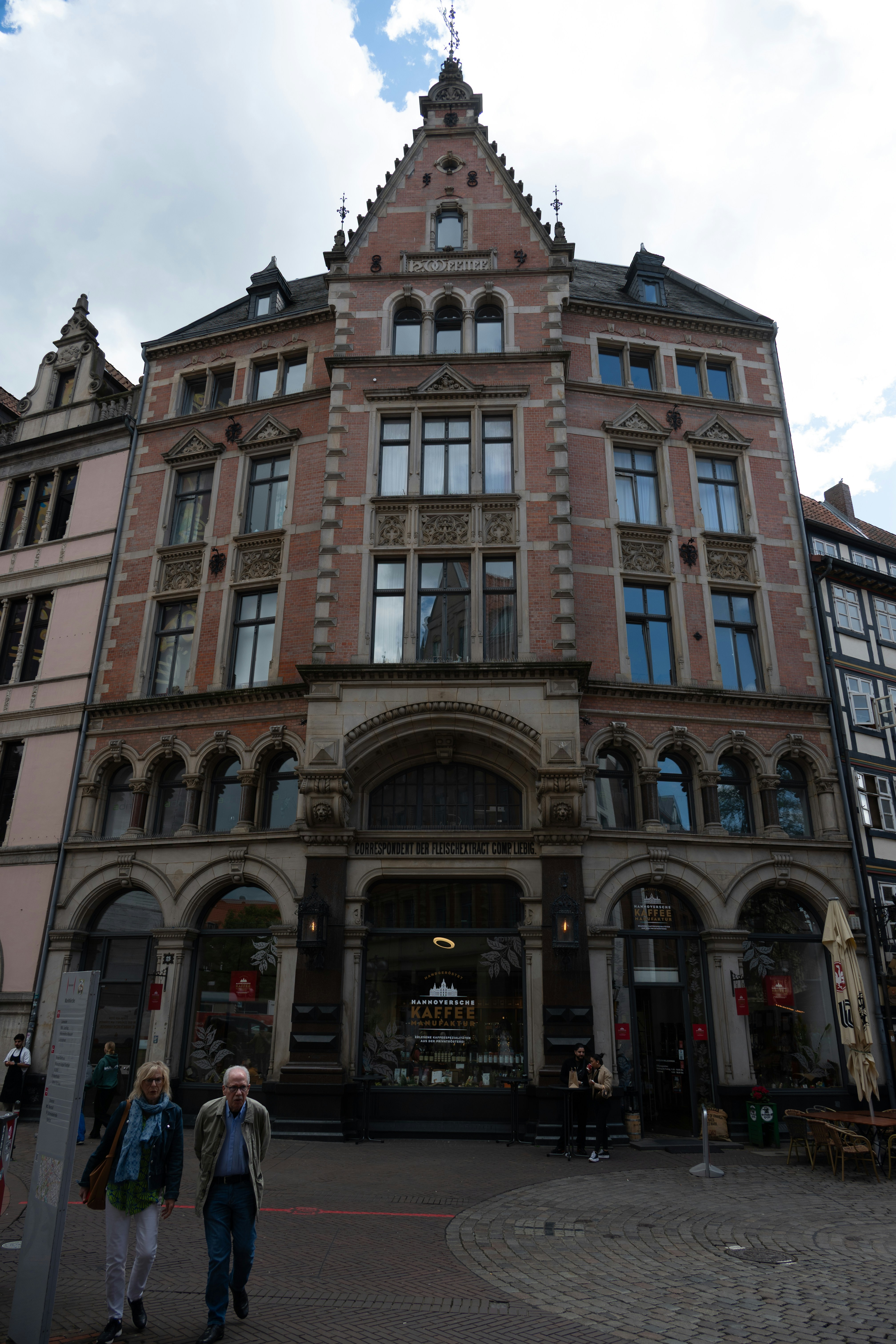 Facade Anatomy: A Historic Gabled Company House Framing a Cobblestone Street