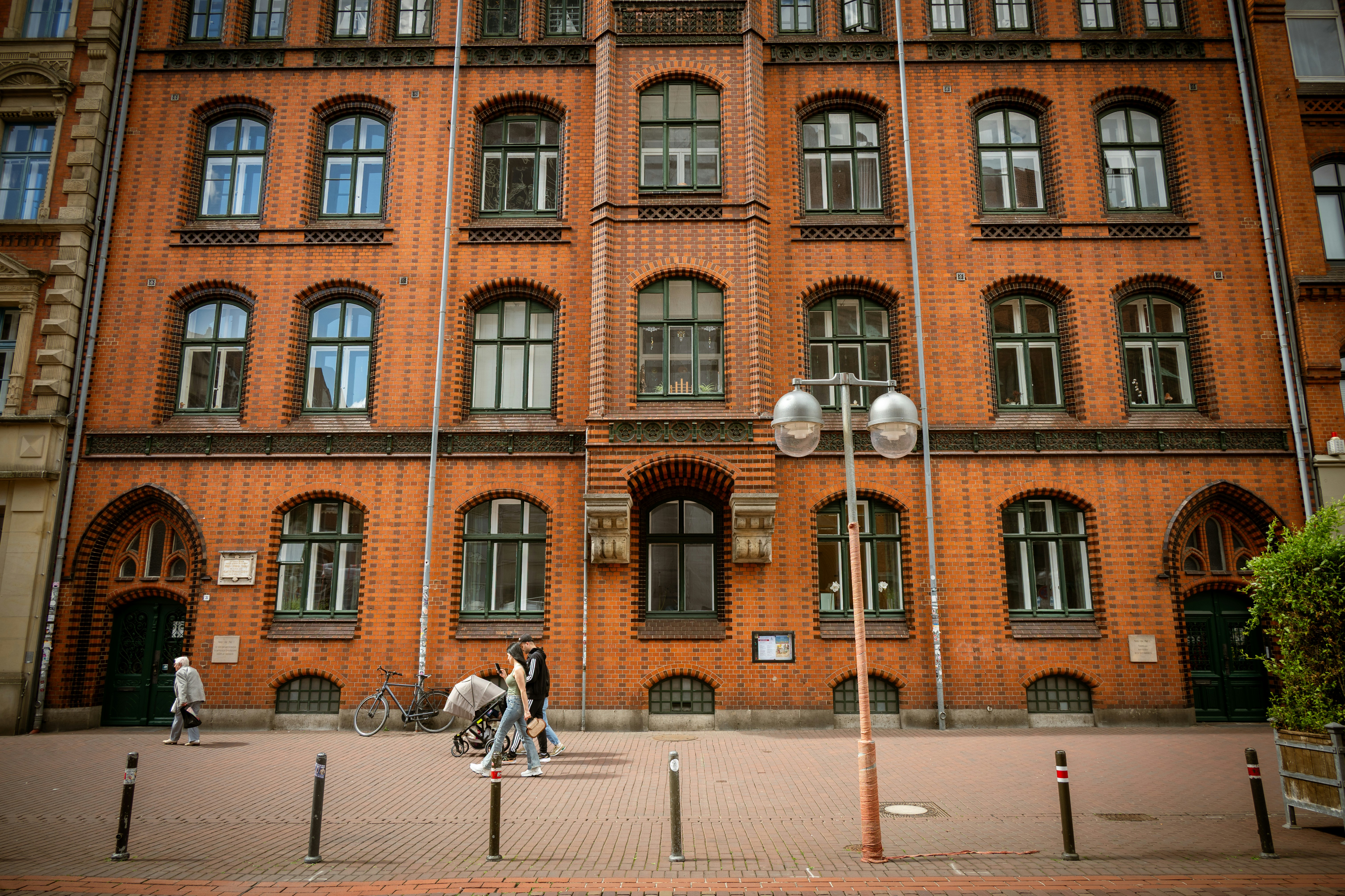 Quiet City Street in Front of a Brick Facade