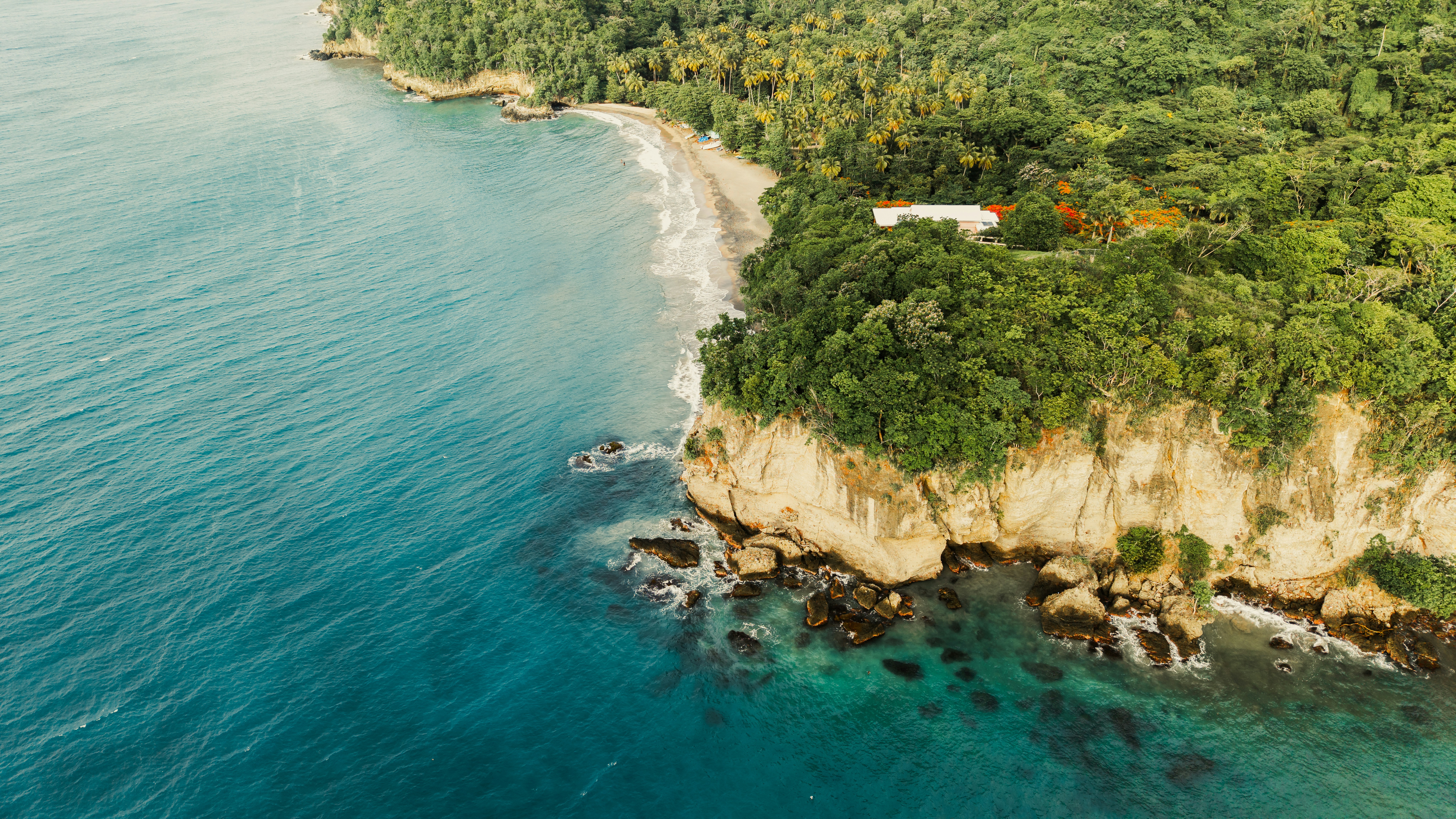 Cliffside Cove: Aerial Vistas Over Turquoise Waves