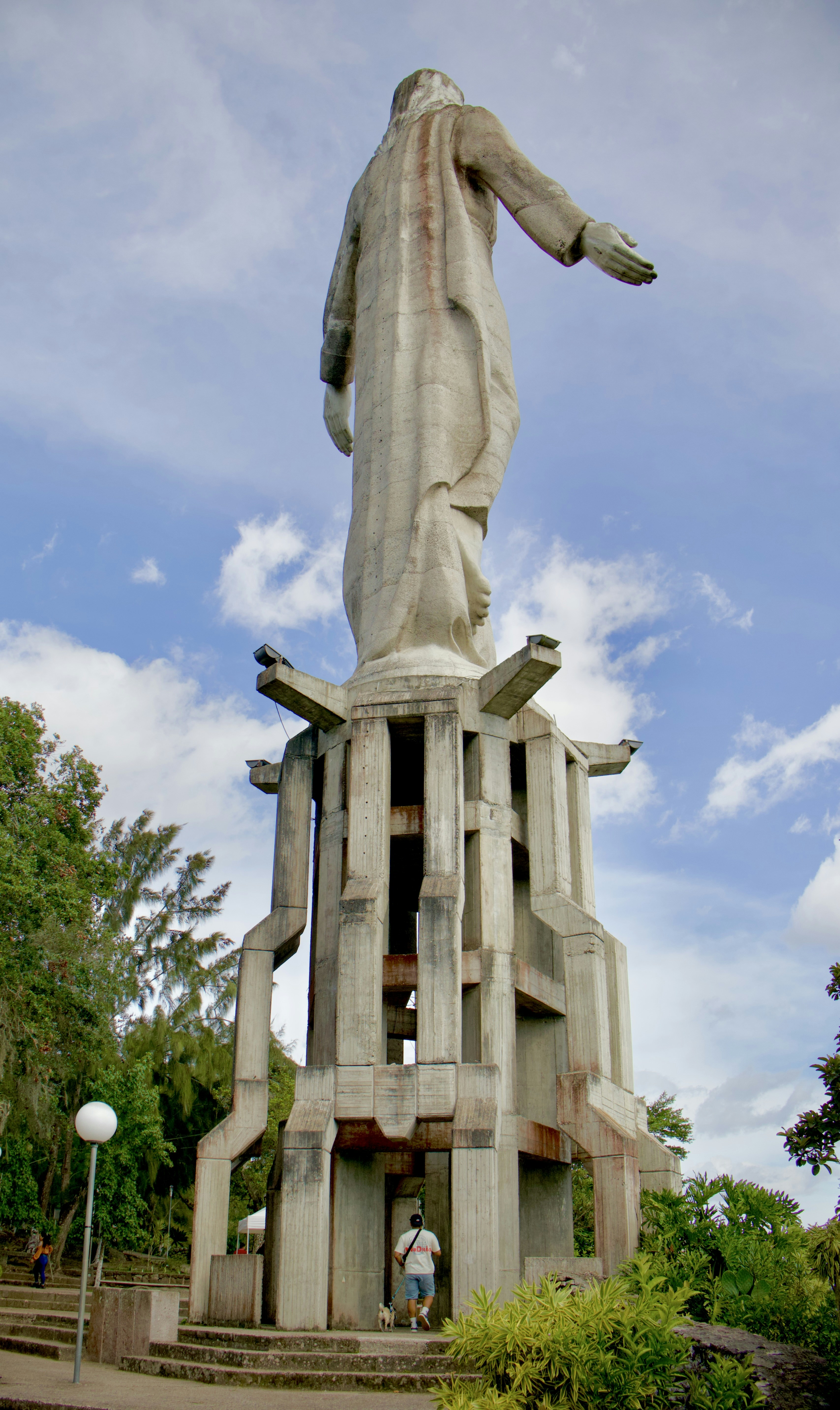 Heroic statue rising above the geometric plinth