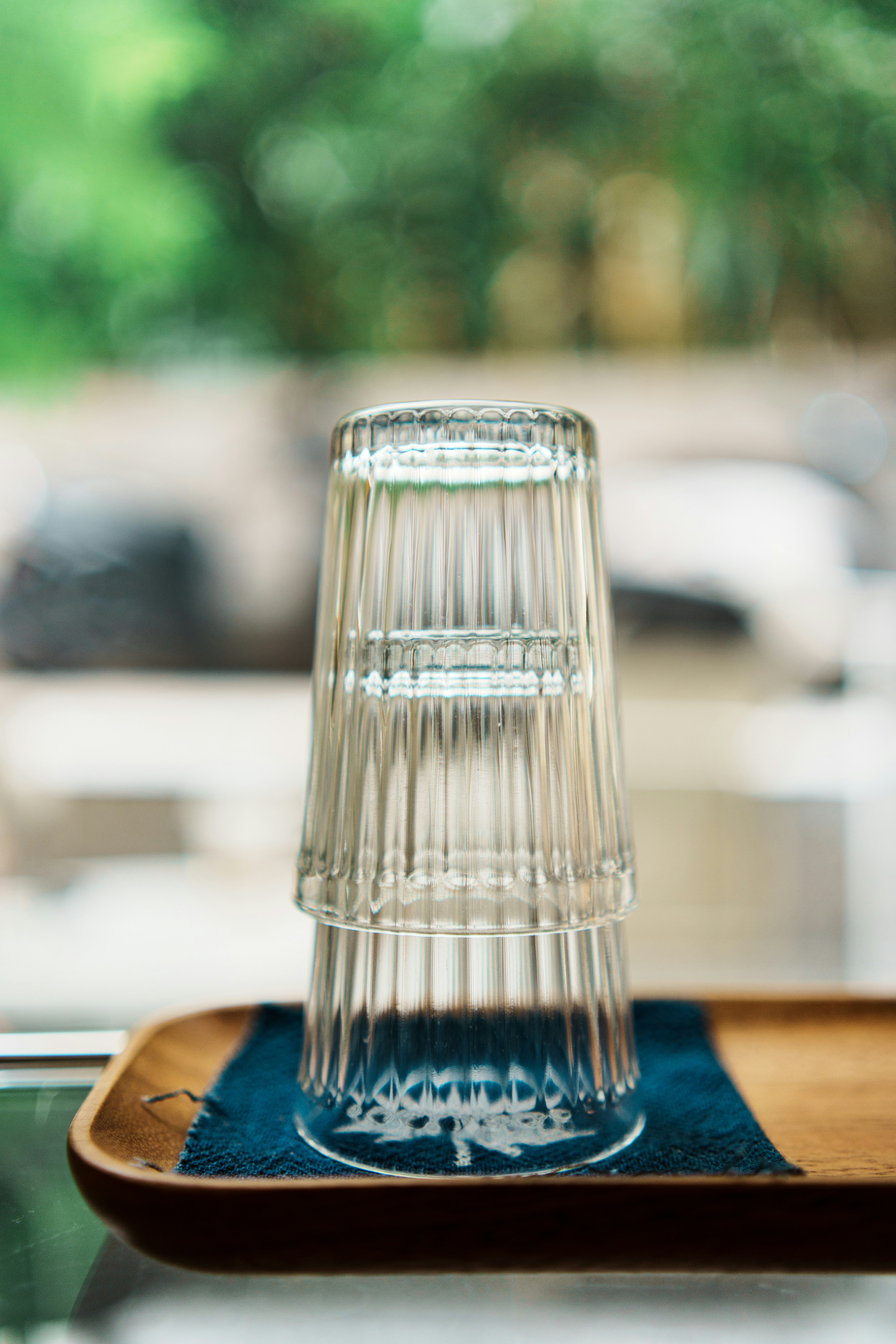 Stack of Glass: A Quiet Moment of Reflection by the Tap