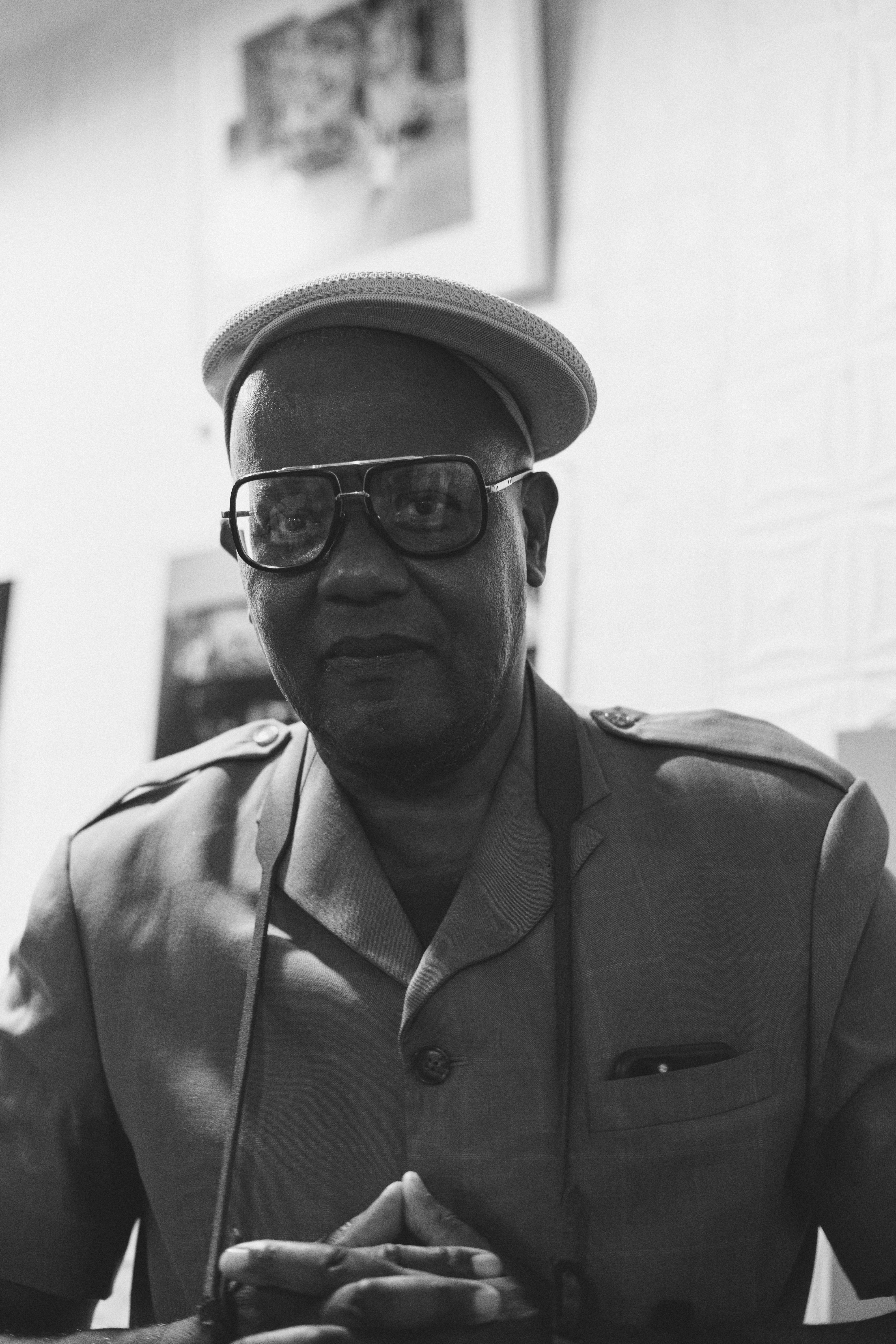 Gentleman in Classic Attire Beneath a Beret