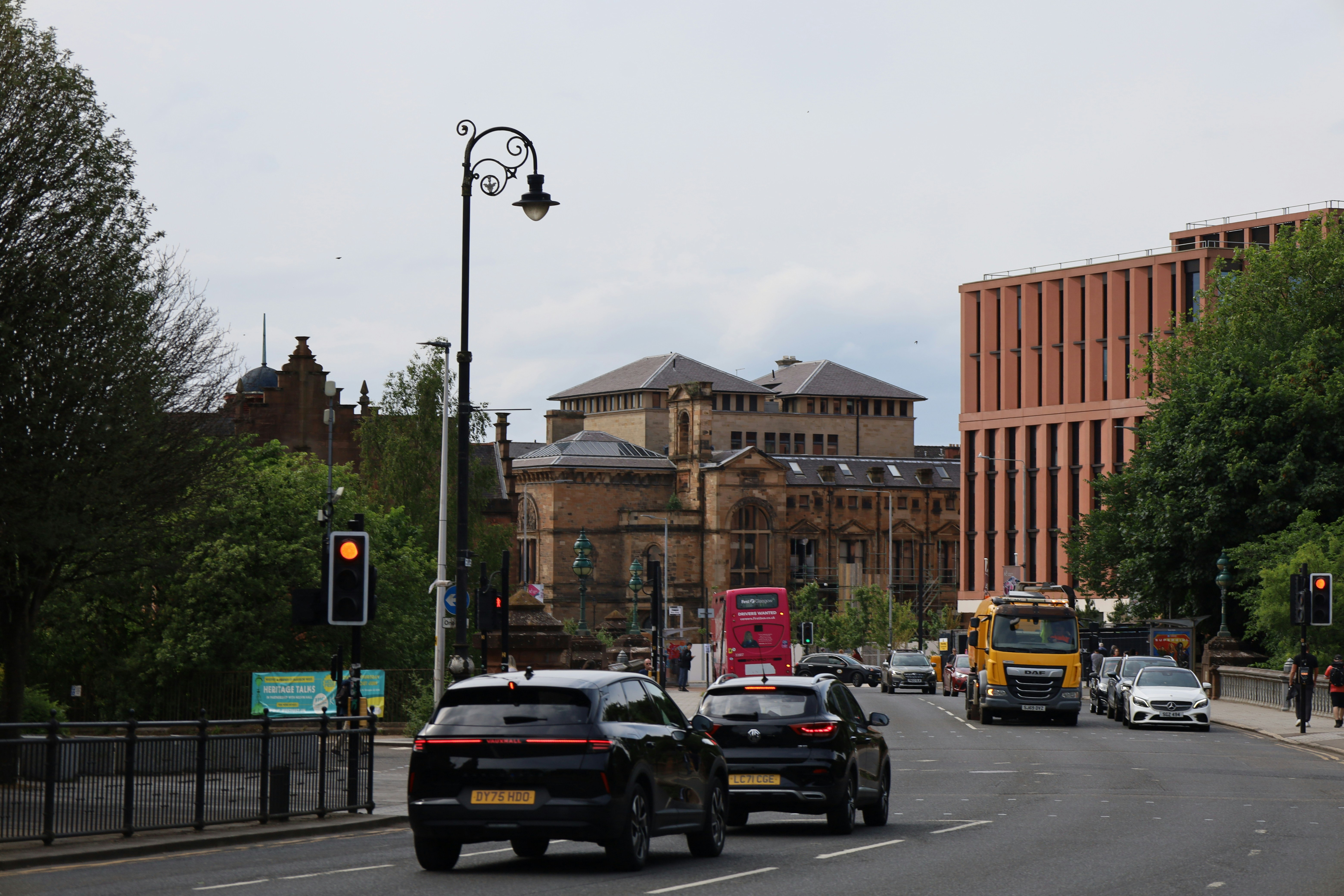 Urban Arteries: Cars, Bus, and Historic Facades on a City Street