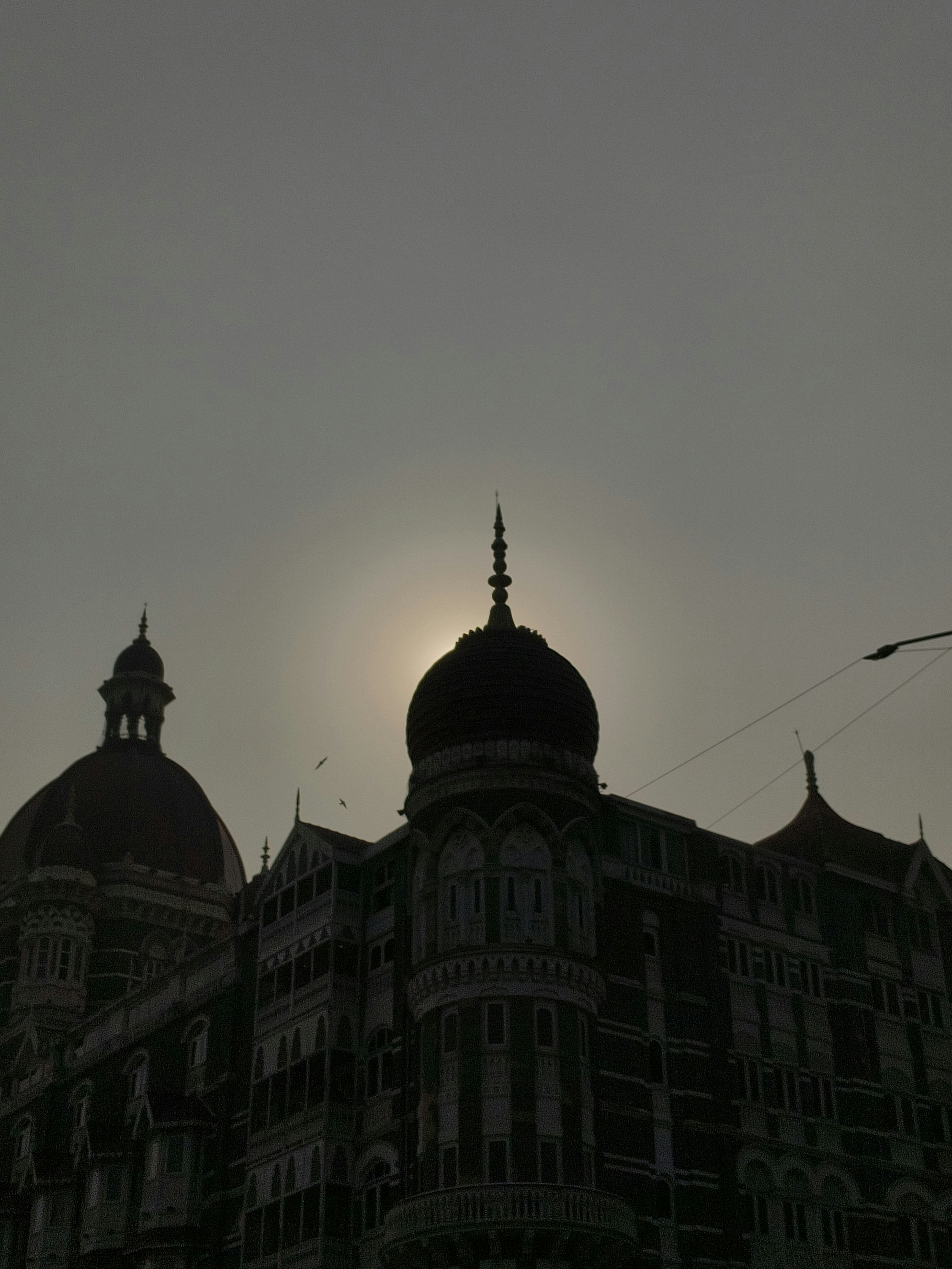 Rising Sun Behind the Silhouette: Indo-Byzantine Rooftops at Dusk