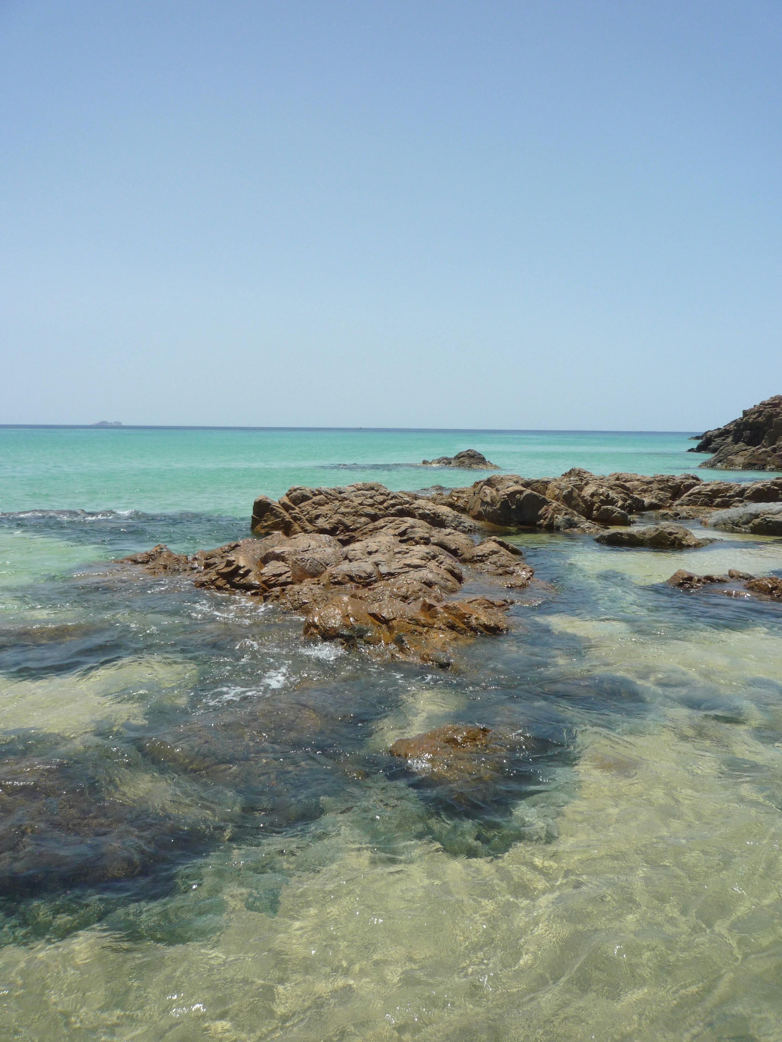Coastal Tides over Weathered Rocks