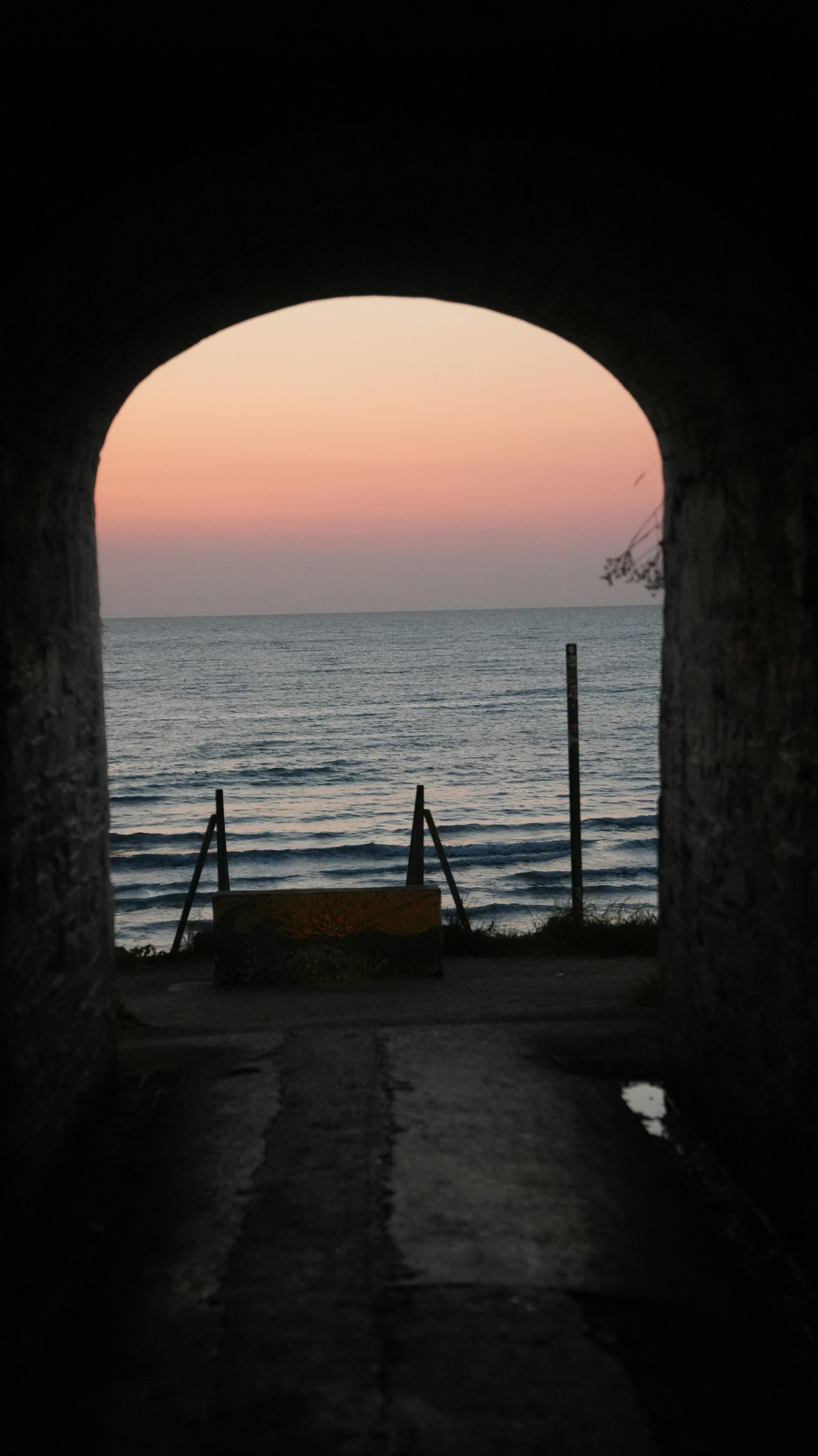 Sunset Framed by the Gate: Sea Outlook from the Archway
