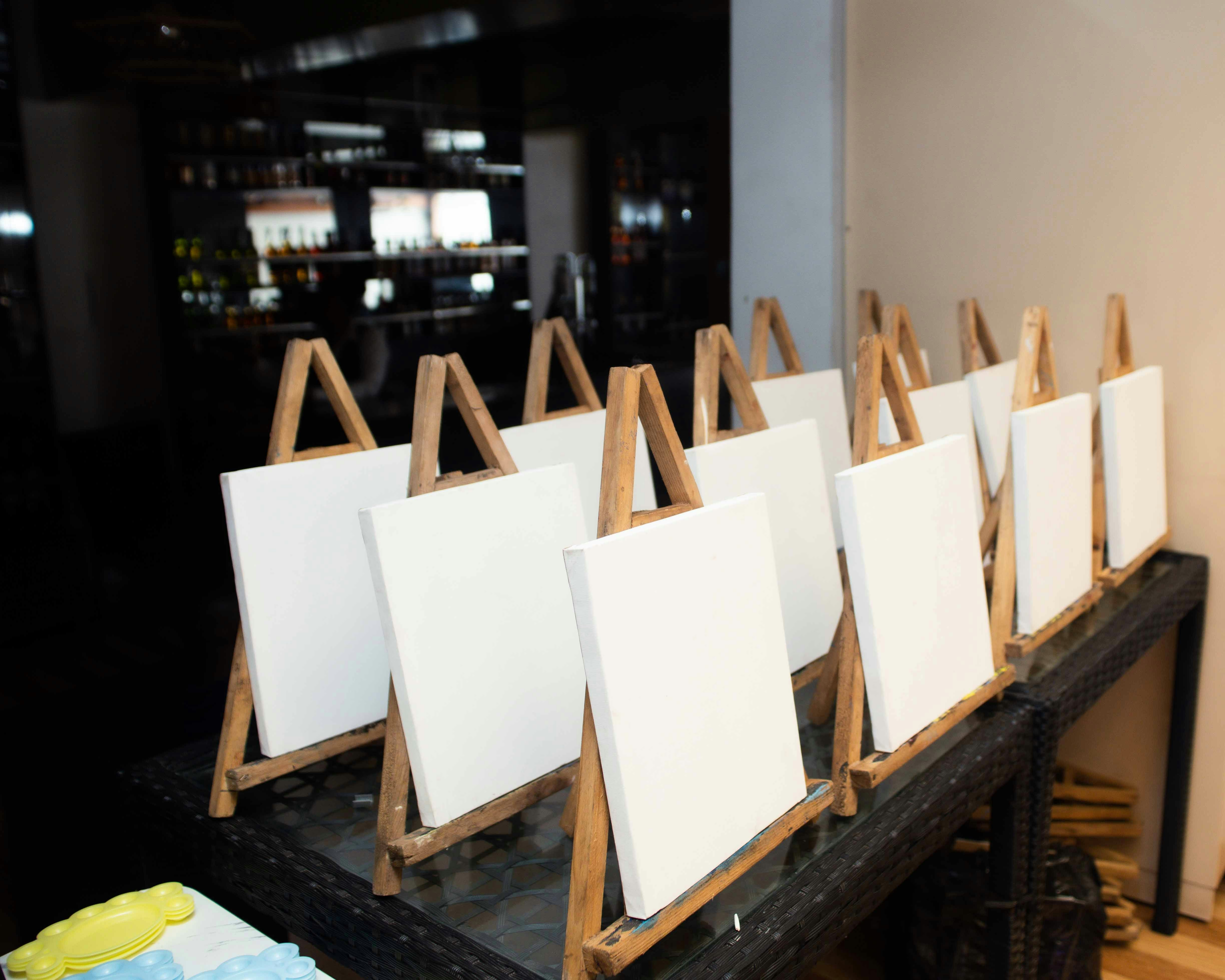 Row of Mini Easels: Blank Canvases in a Studio Display