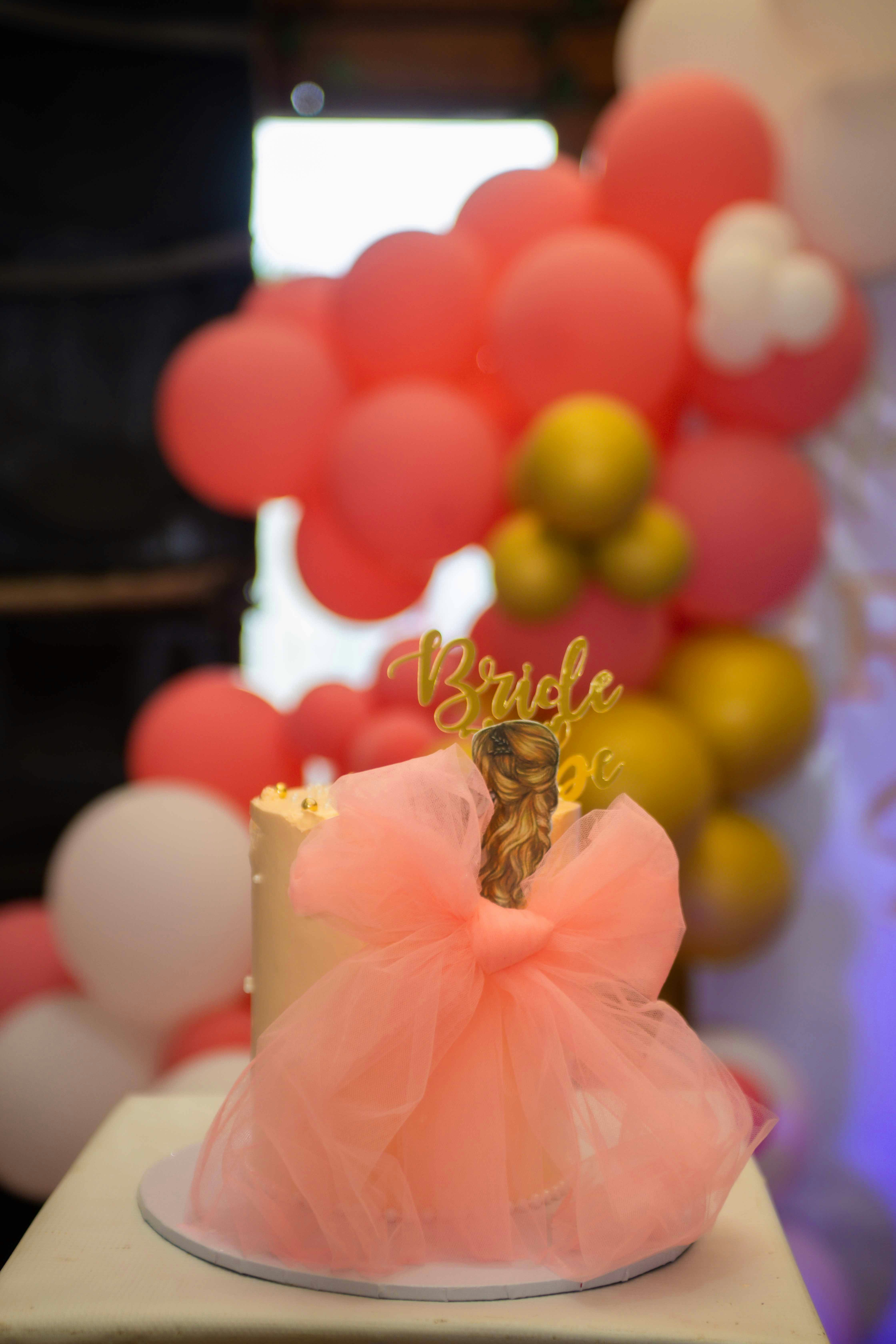 Soft Pink Couture: A Bride Cake Under Balloon Arch