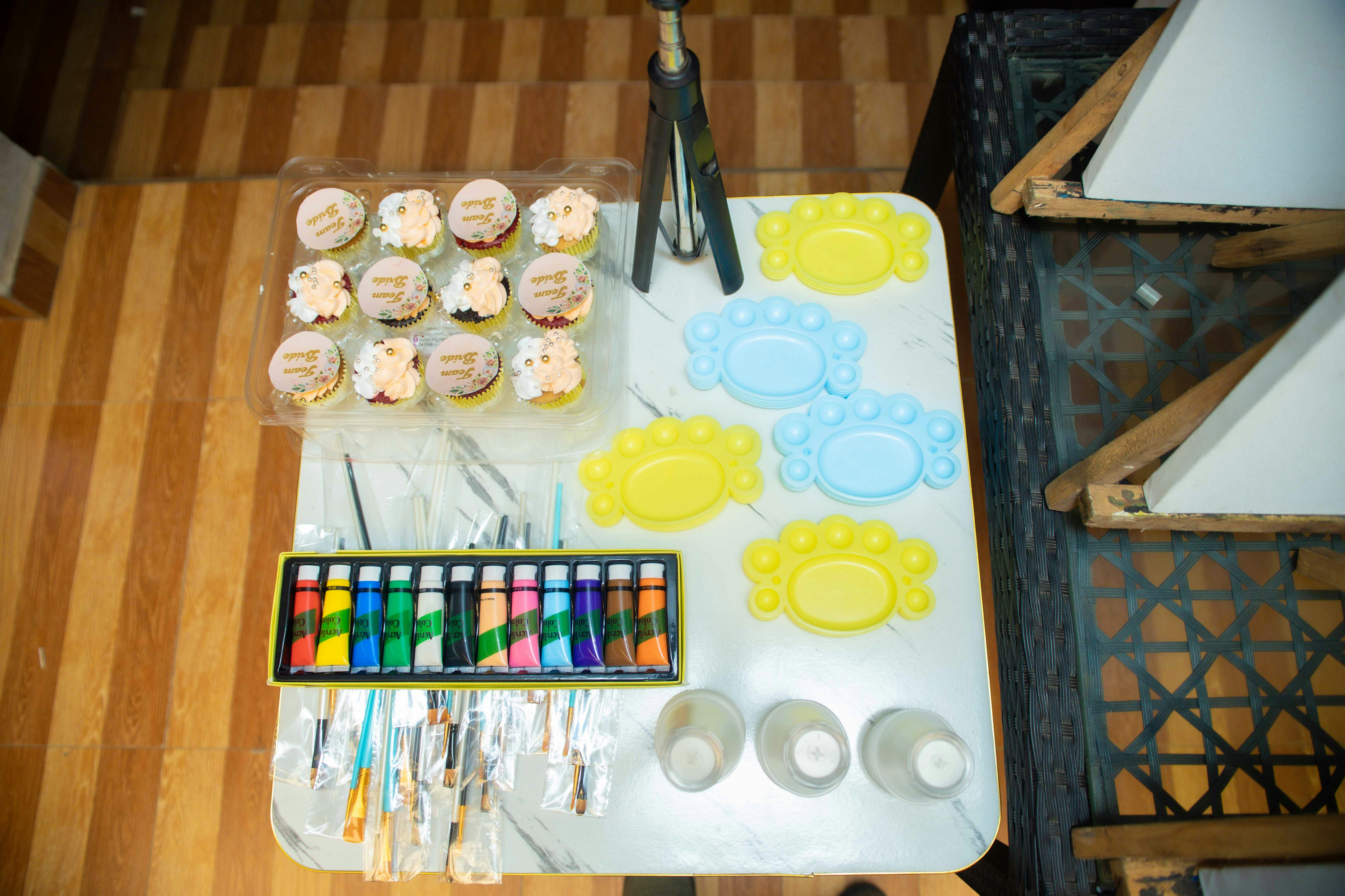 Pastel Palette and Cupcakes on a Craft Table