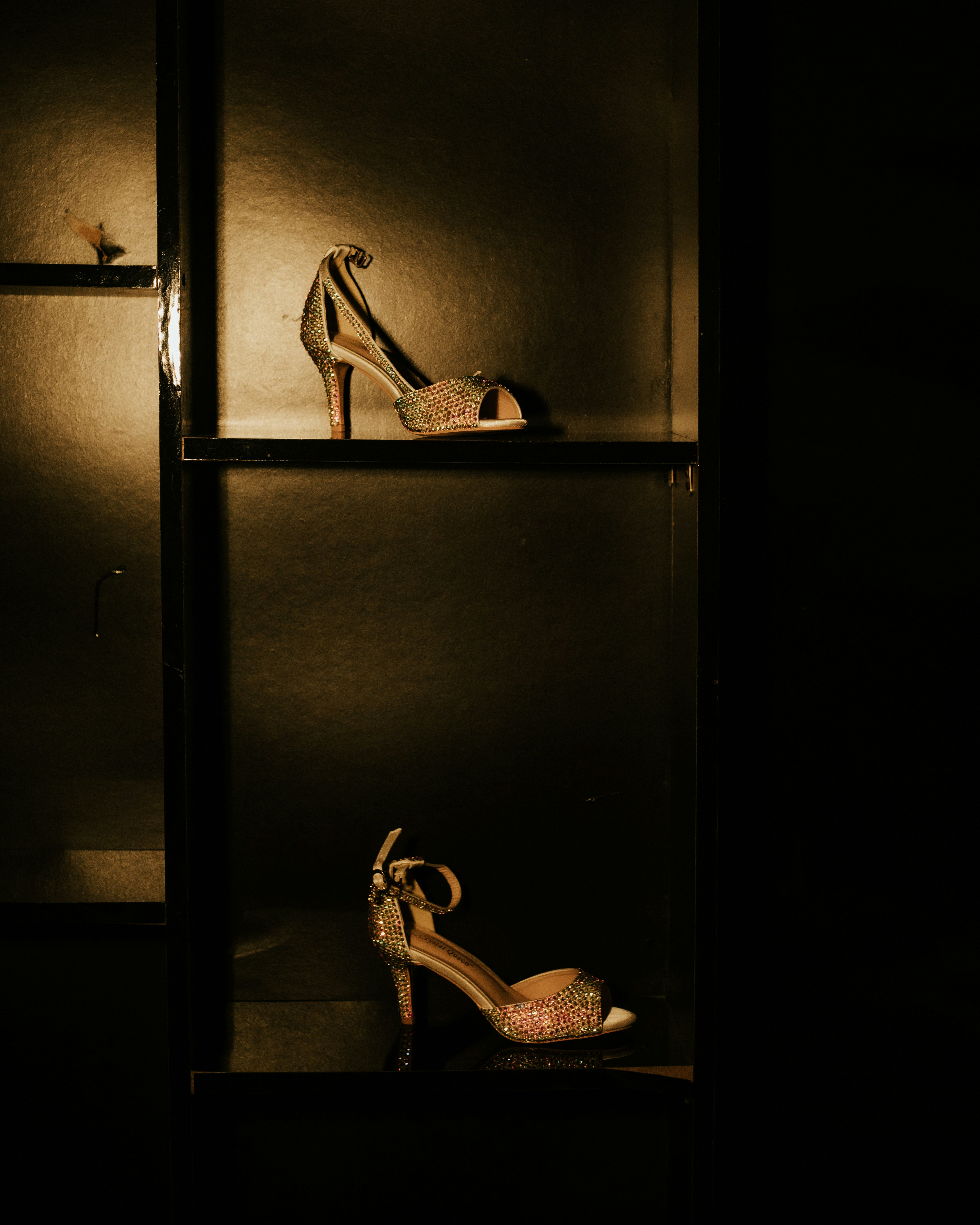 Spotlight on the jeweled heels: a two-tier display of elegant sandals