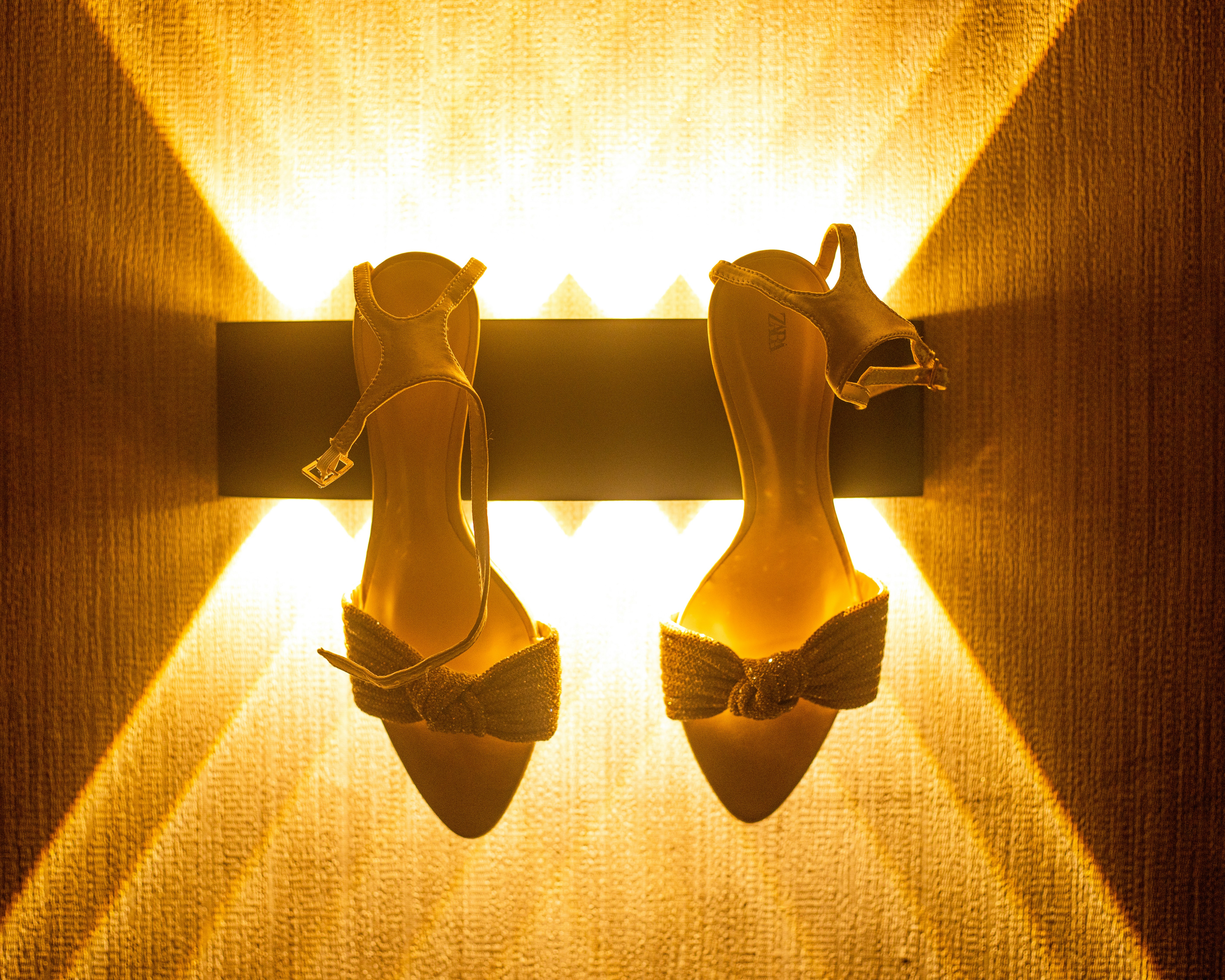 Backlit Ballet: Two Dainty Heels Framed by Glow