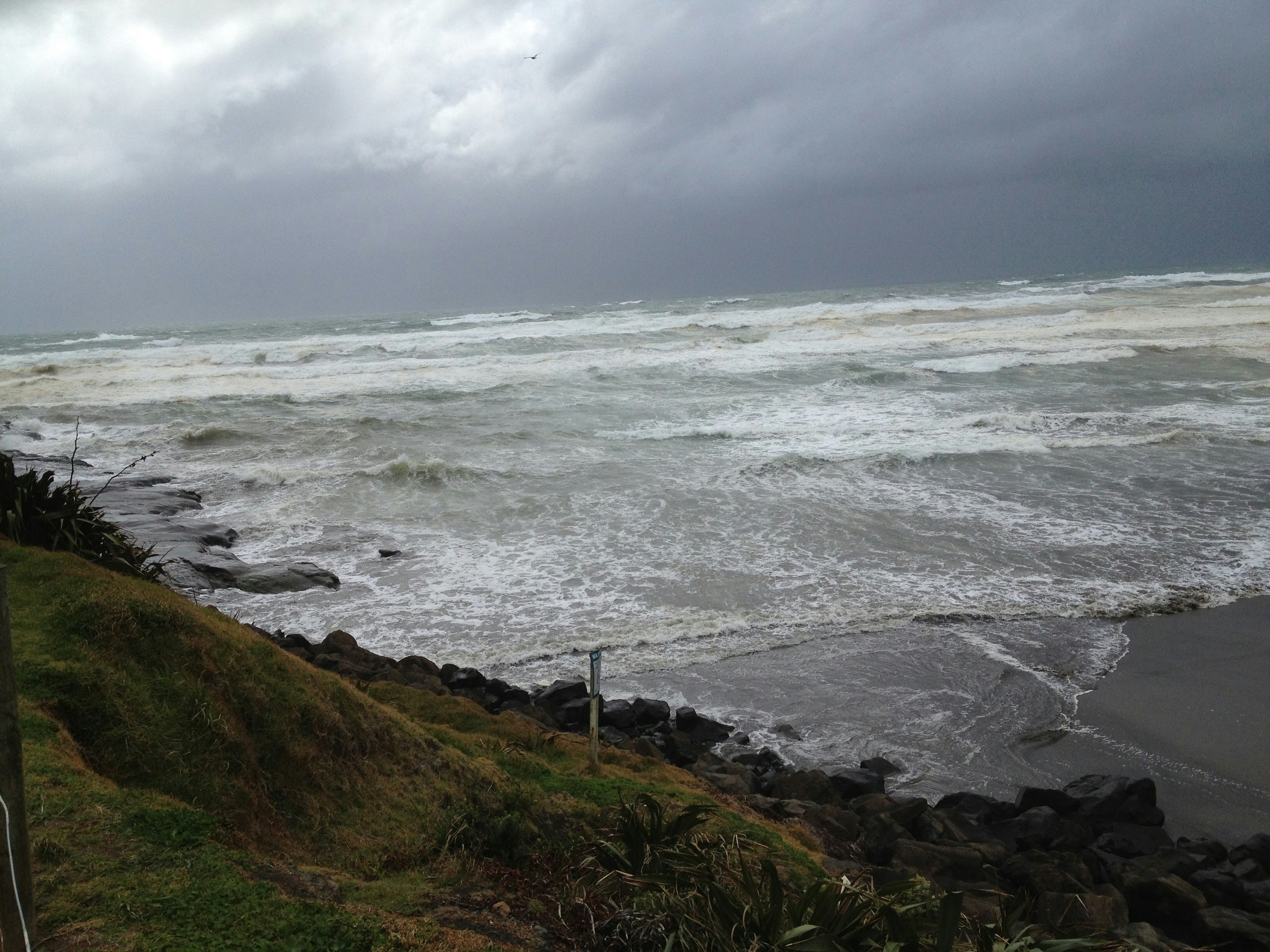 Storm-Lashed Shoreline under a Looming Skein of Clouds