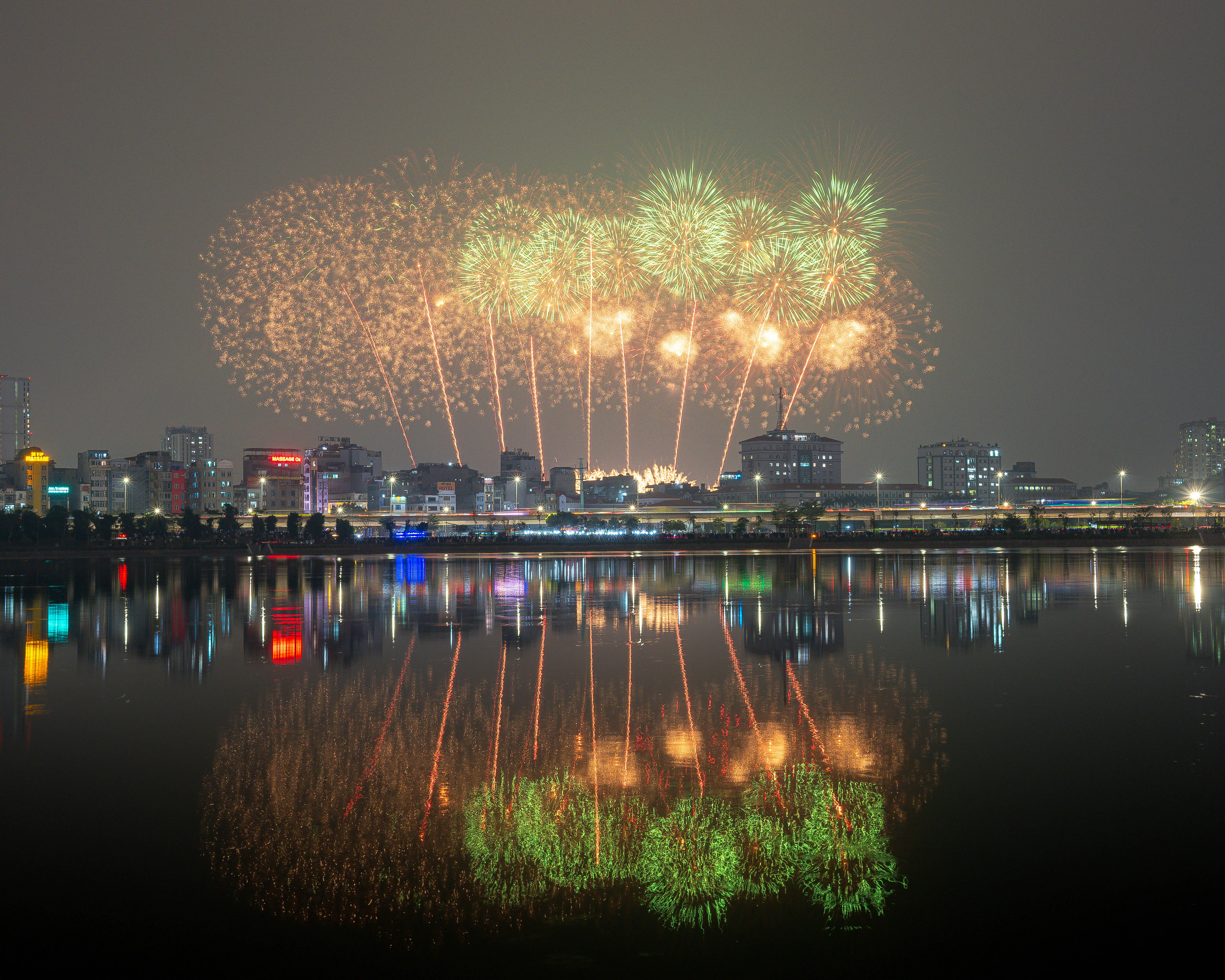 Firework Symmetry Over the Riverfront