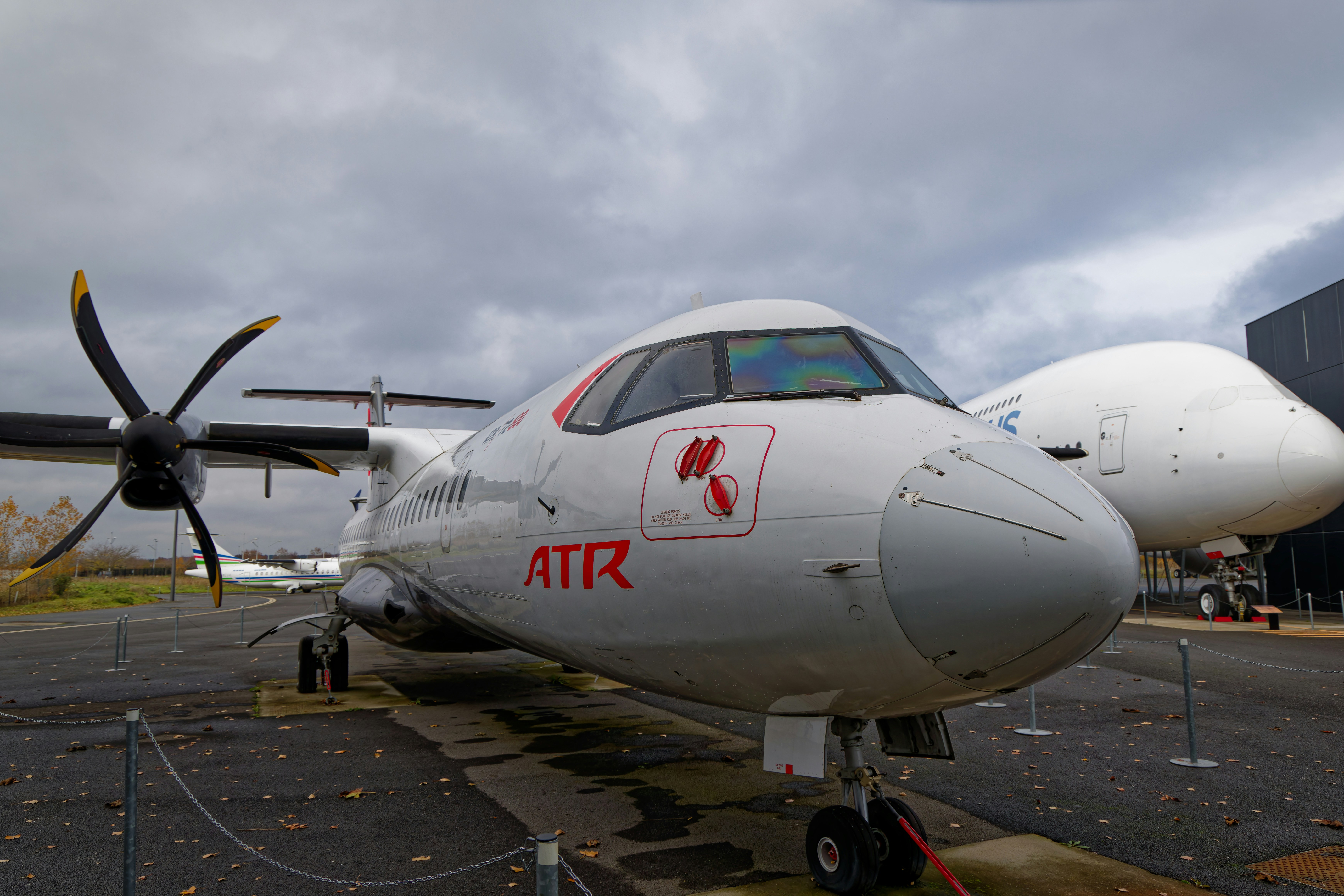 Front-Quarter View of a Parked ATR Aircraft with Propeller on Display