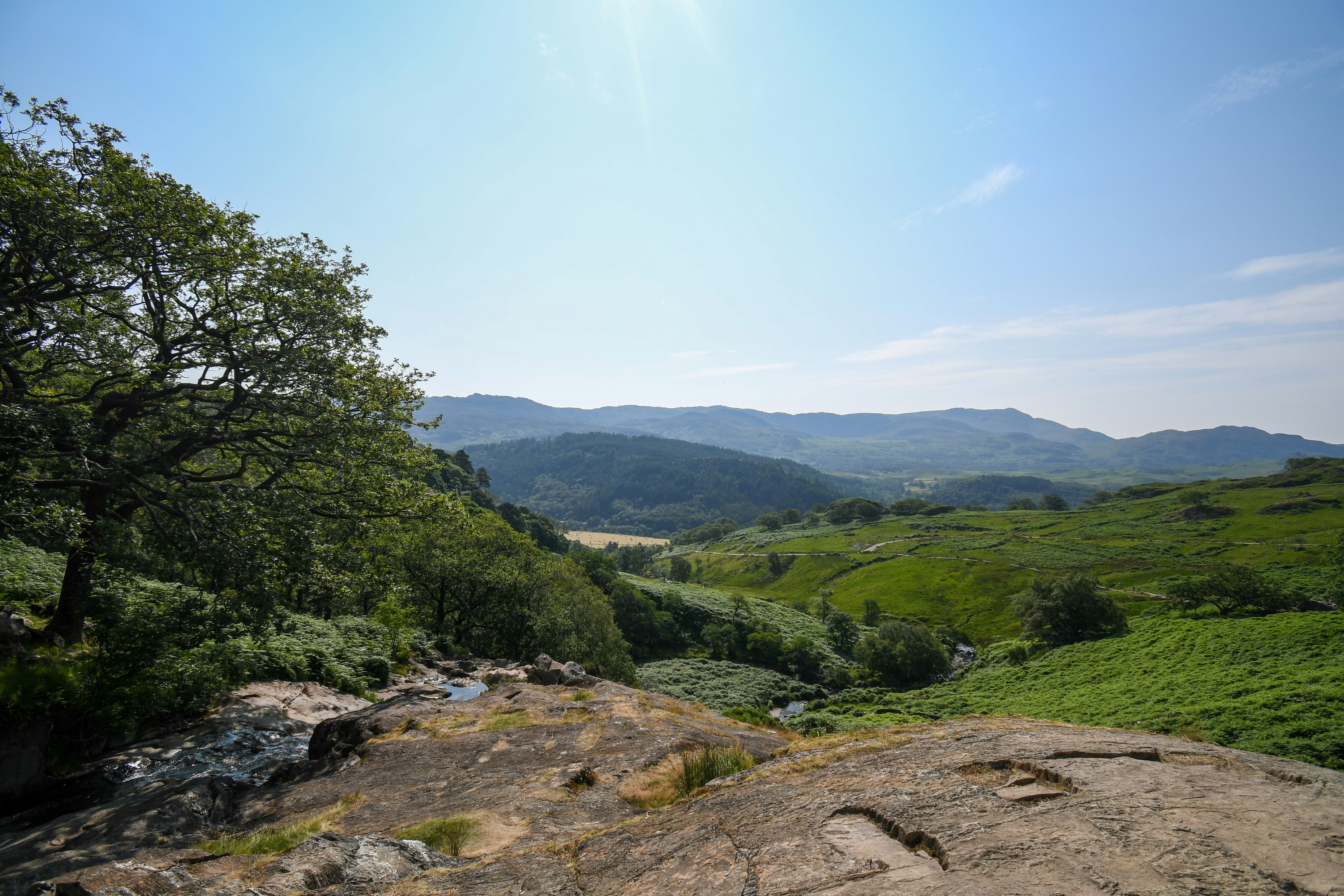 Sunlit Quarry Overlook: Rolling hills and distant ridges
