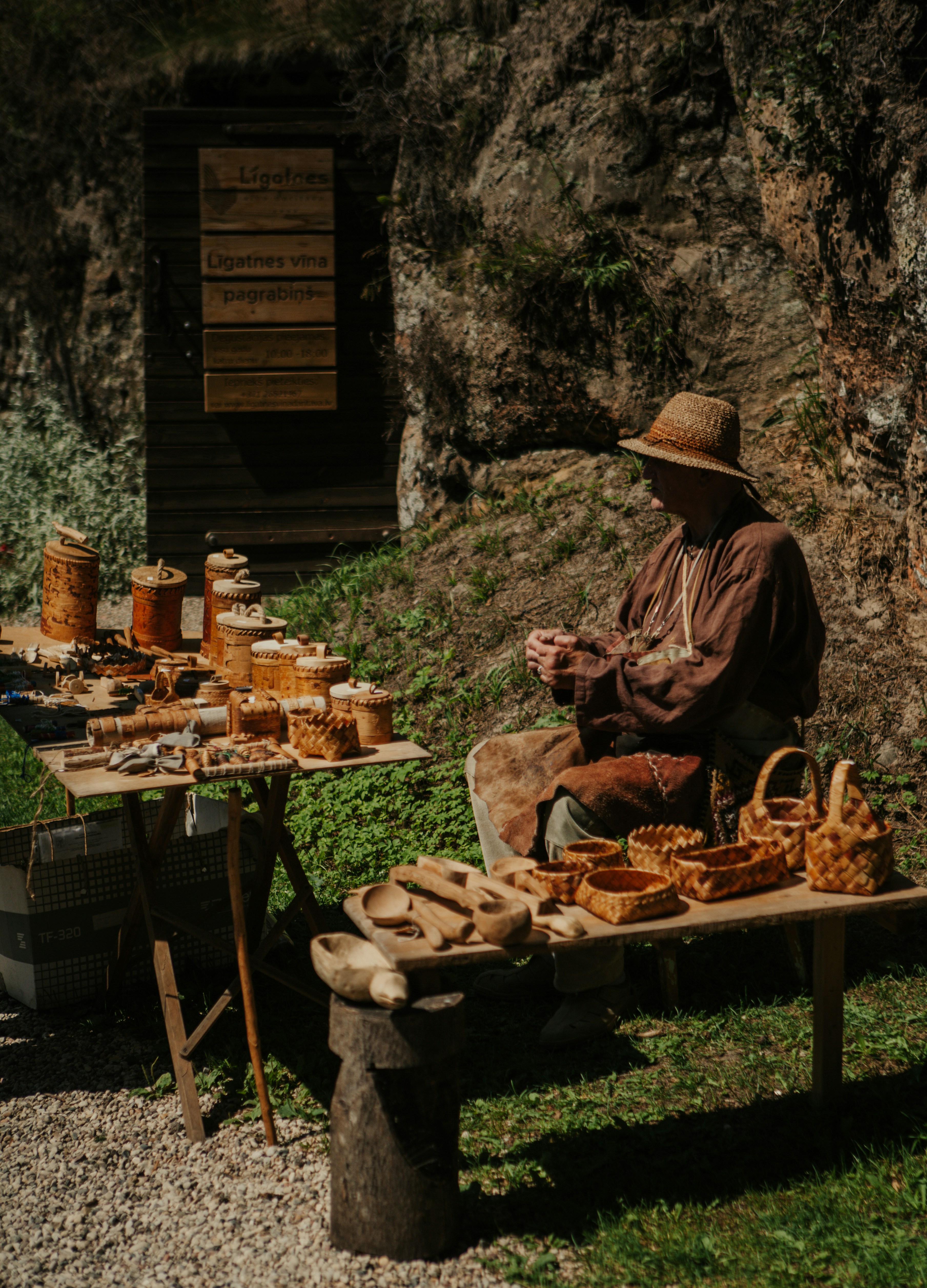 Craftsman at a Rustic Stall:Clay and Basketry Under Warm Light