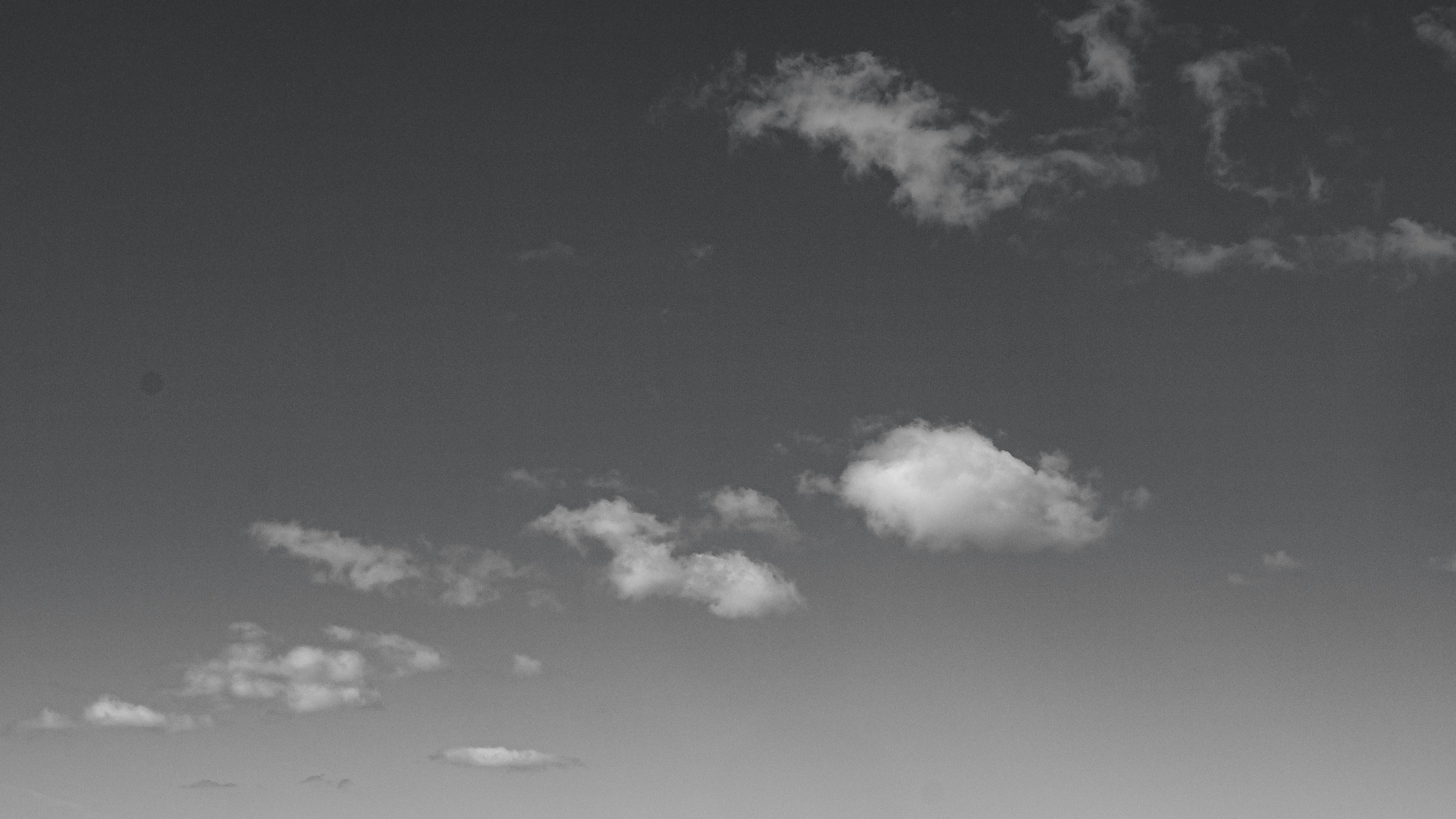 Clouds in a Quiet Sky: A Minimal Monochrome Landscape