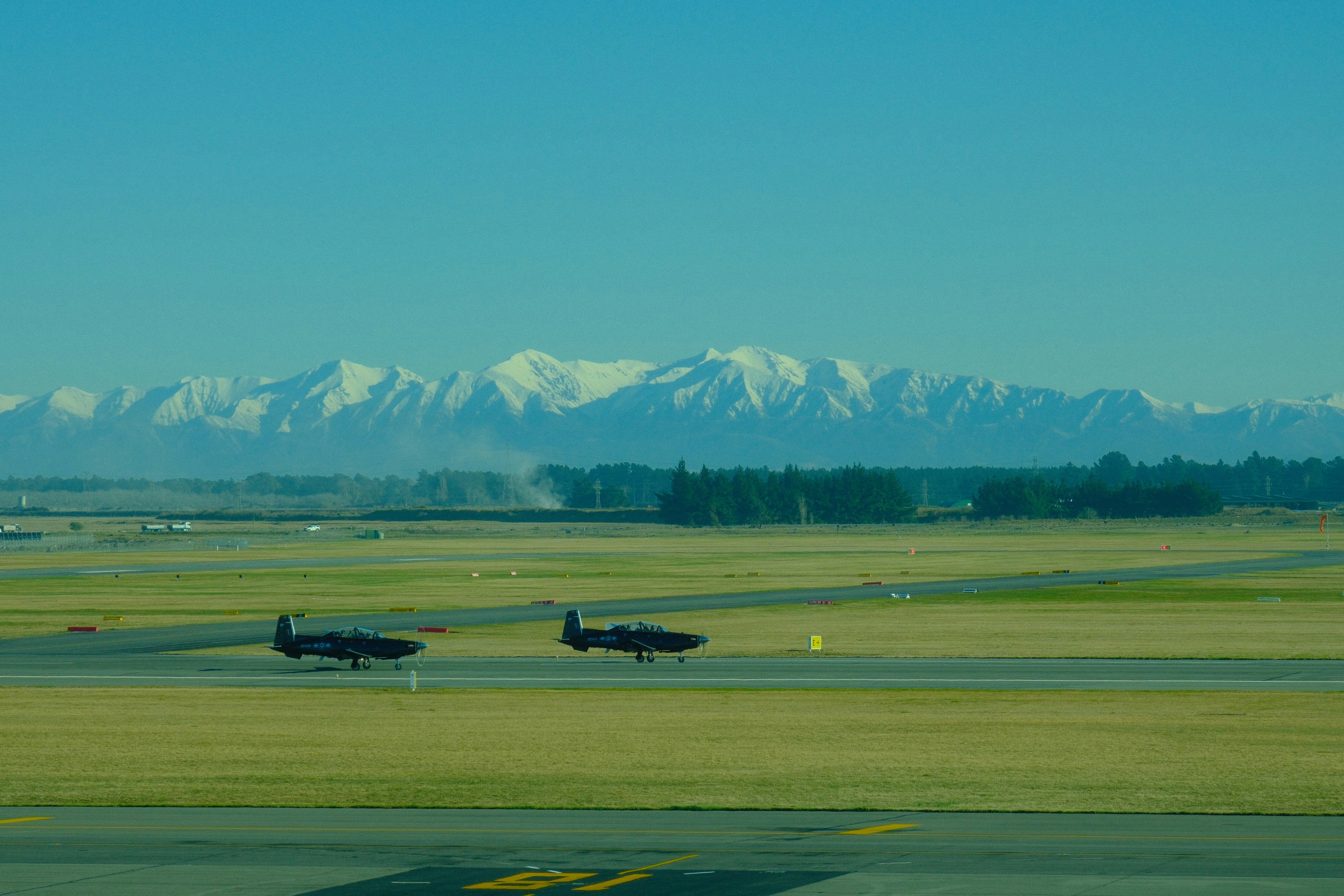 Quiet Tarmac: Twin Jets and the Snowcaps