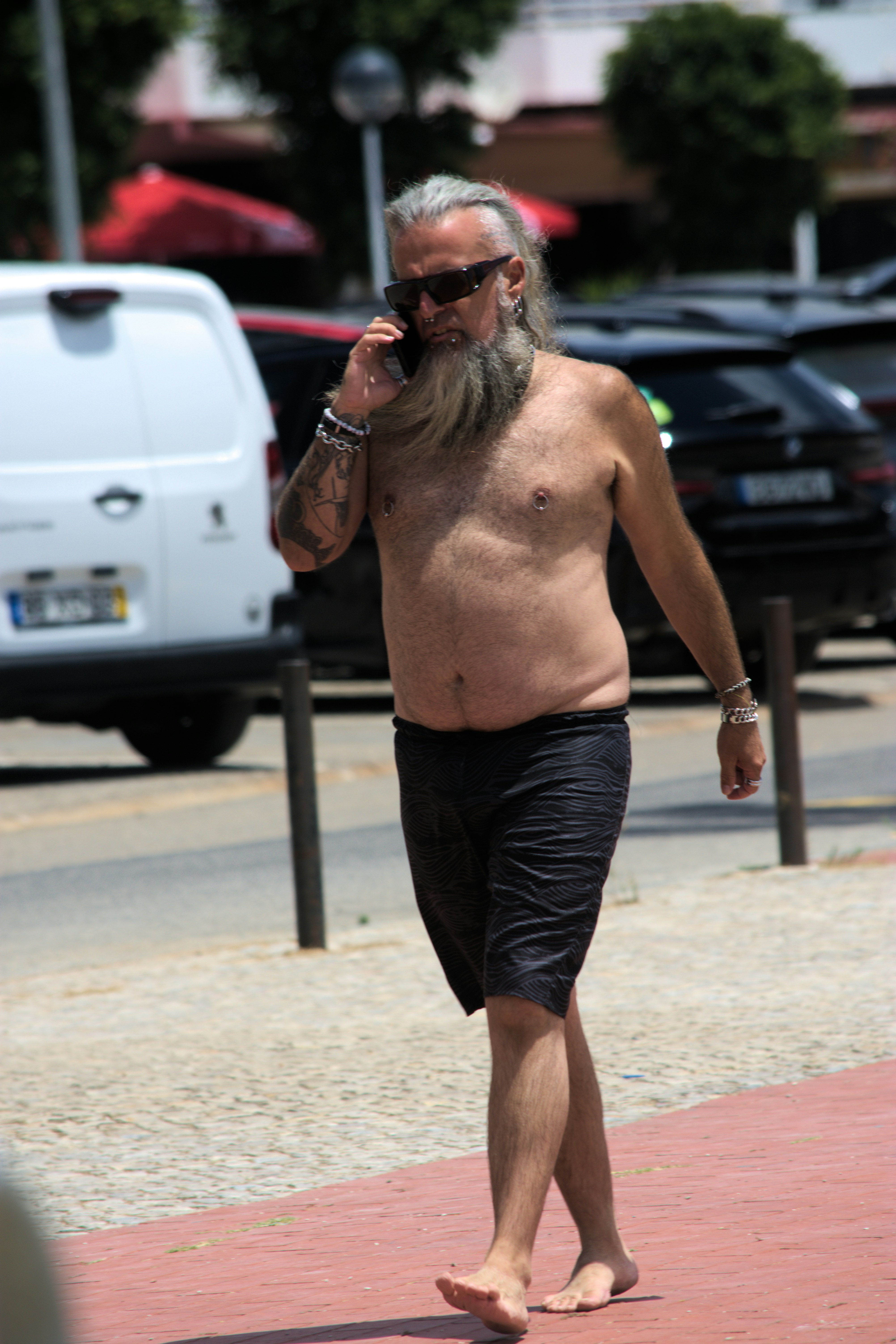 Bearded Wanderer on a City Promenade