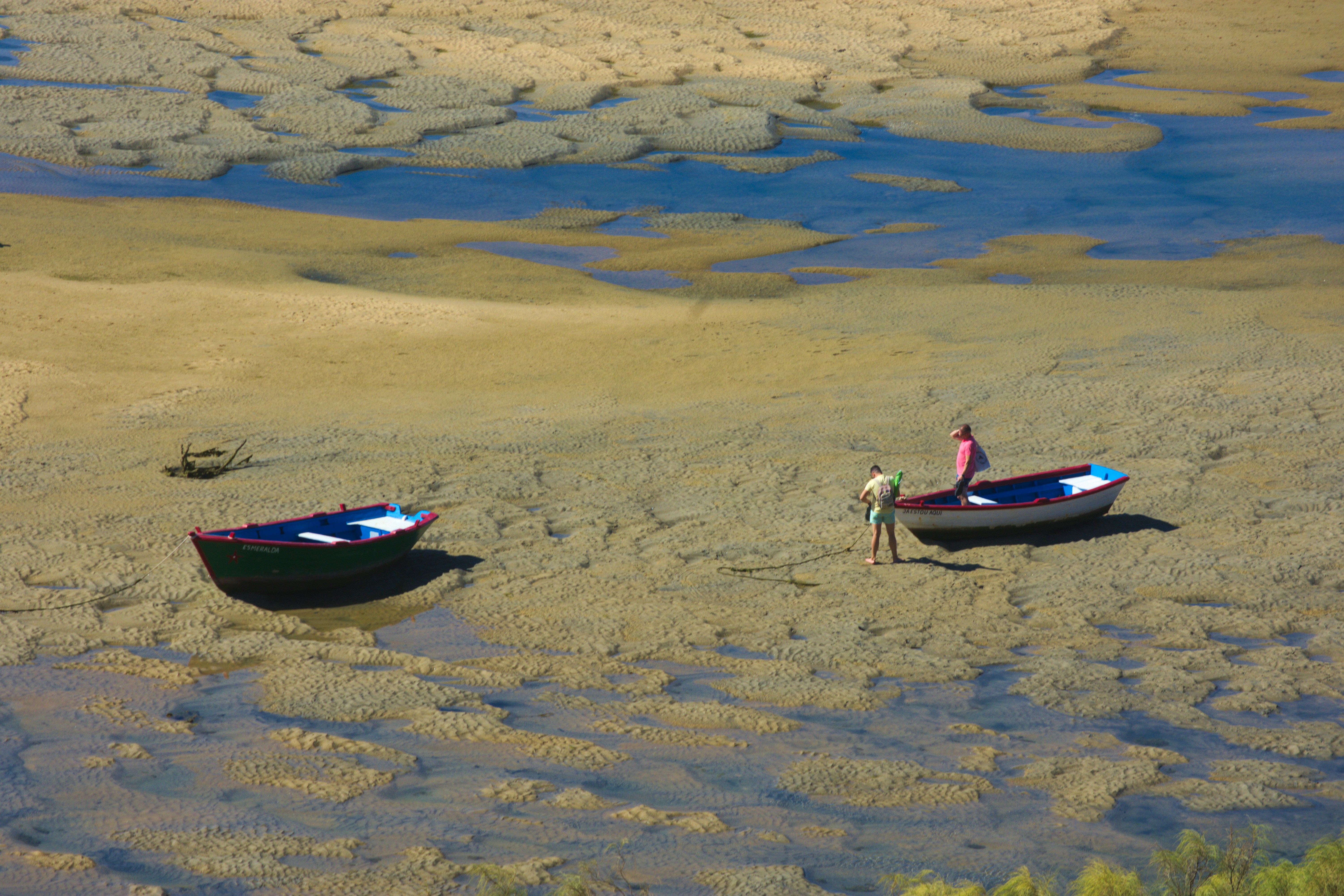 Two Boats Rest on a Tidal Canvas Under Soft Dusk Light