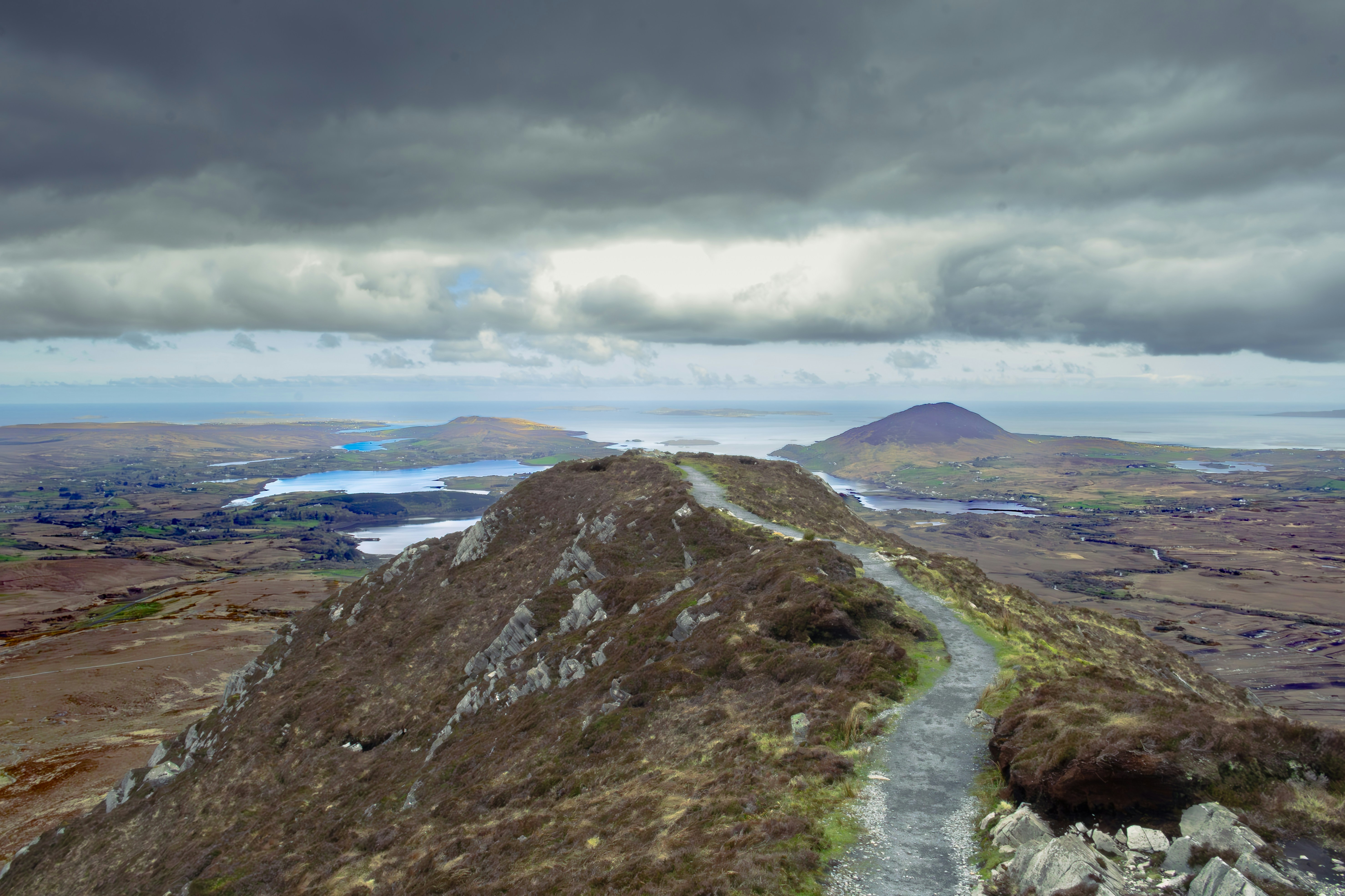 Trail to the Ridge: A Soaring View over Eroded Moorland and Distant Islands