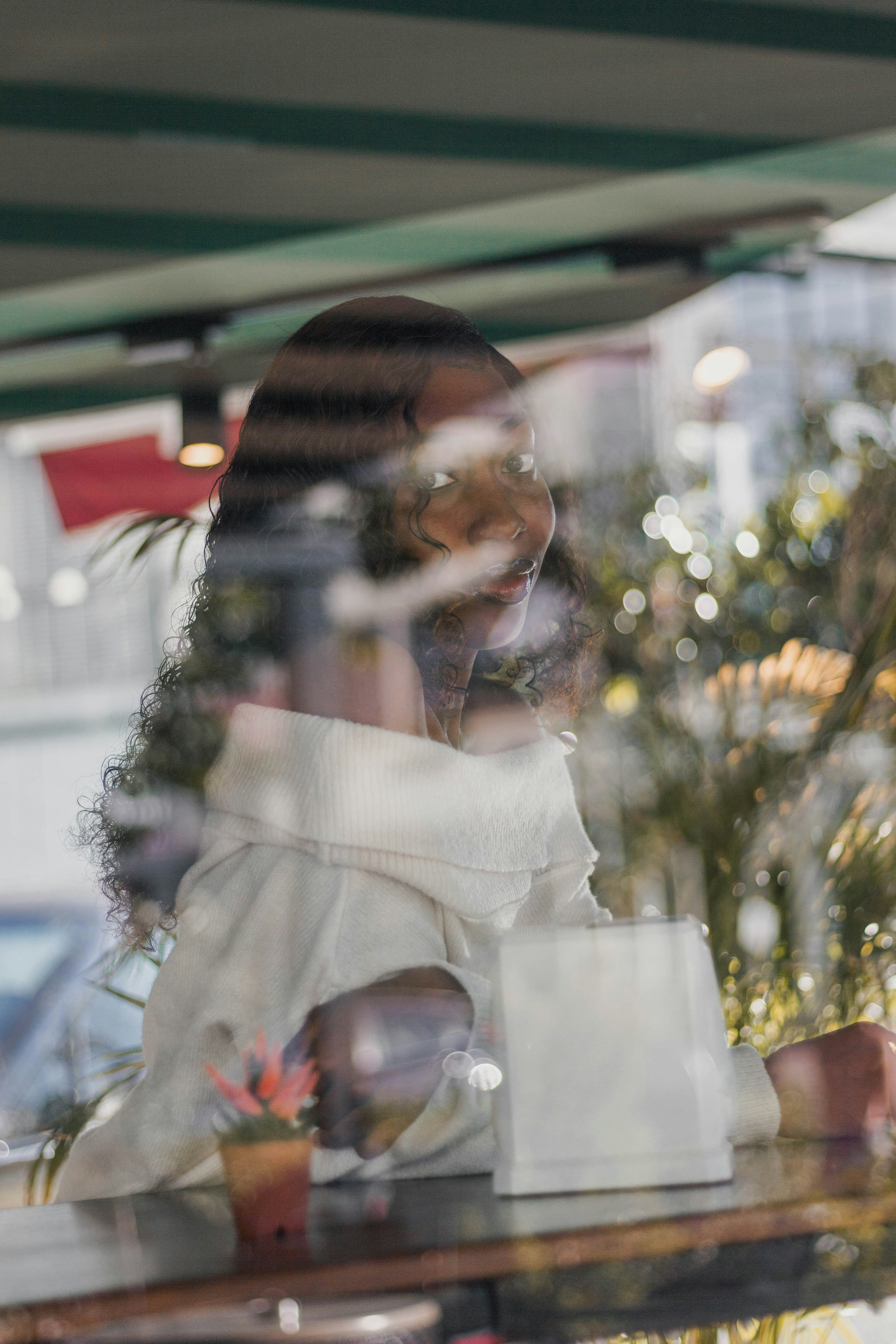 Through the Glass: Portrait Fragments in a Café Window