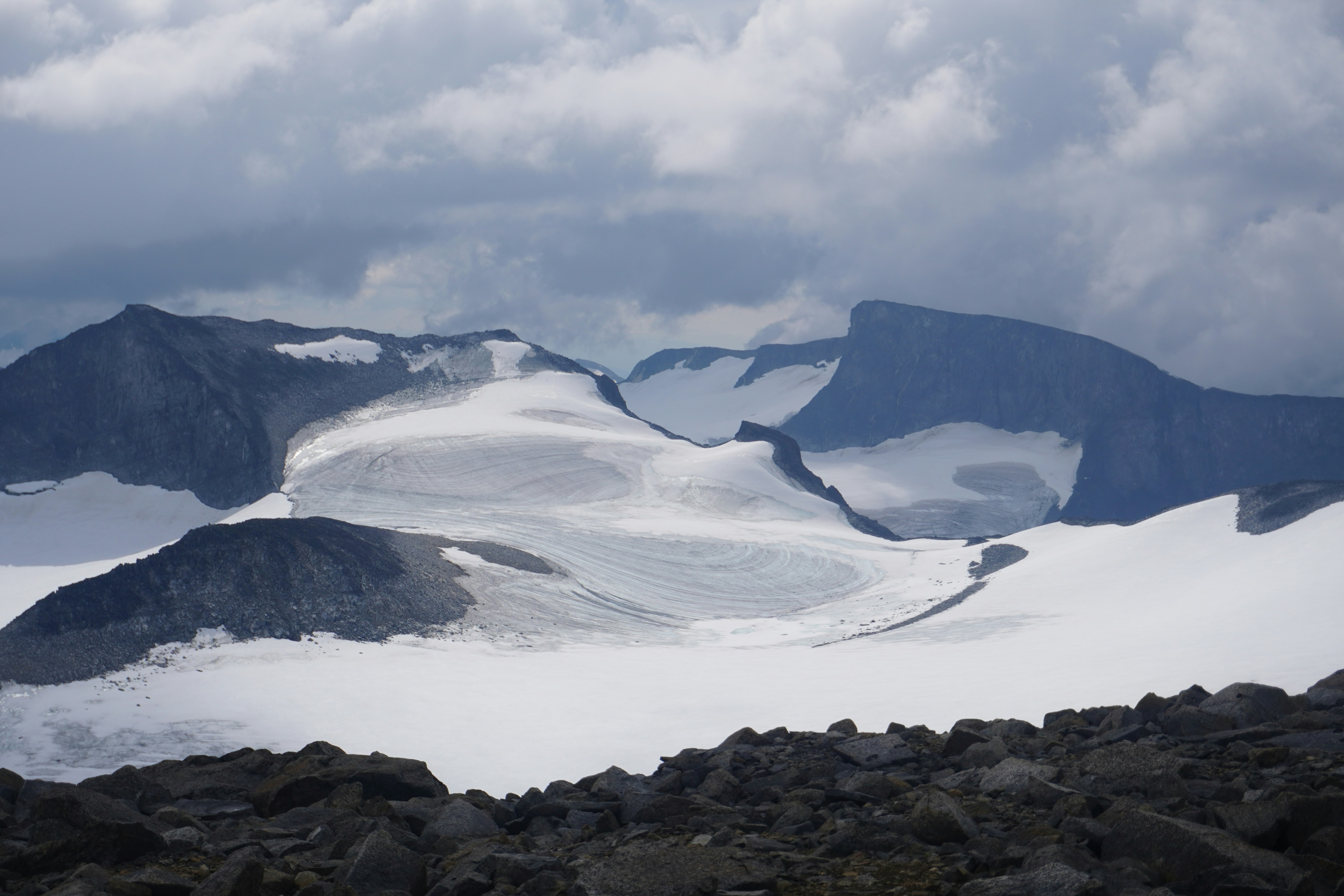 Glacial Crest Under Heavy Skies