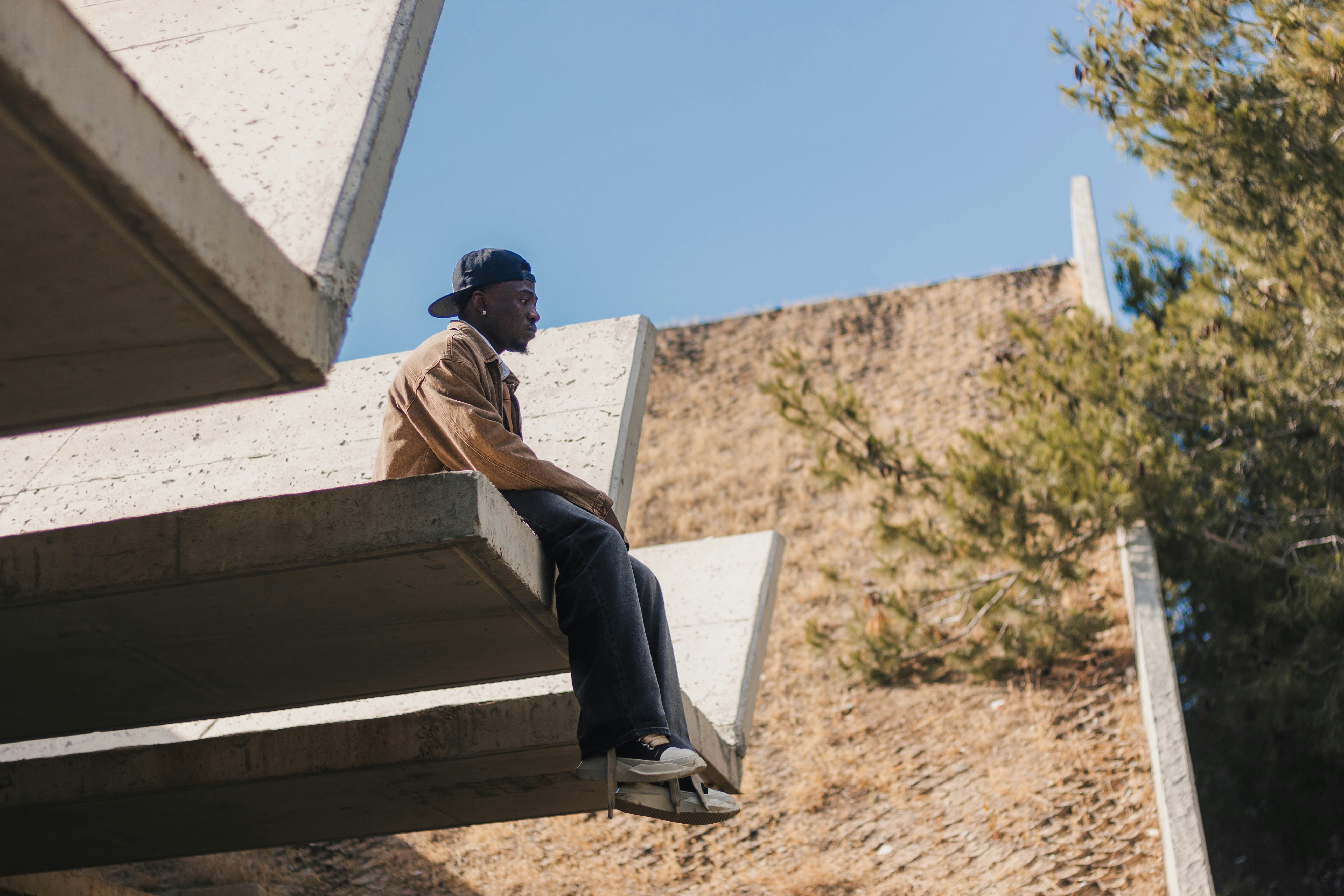 Rooftop Ledge: Contemplation Above the City