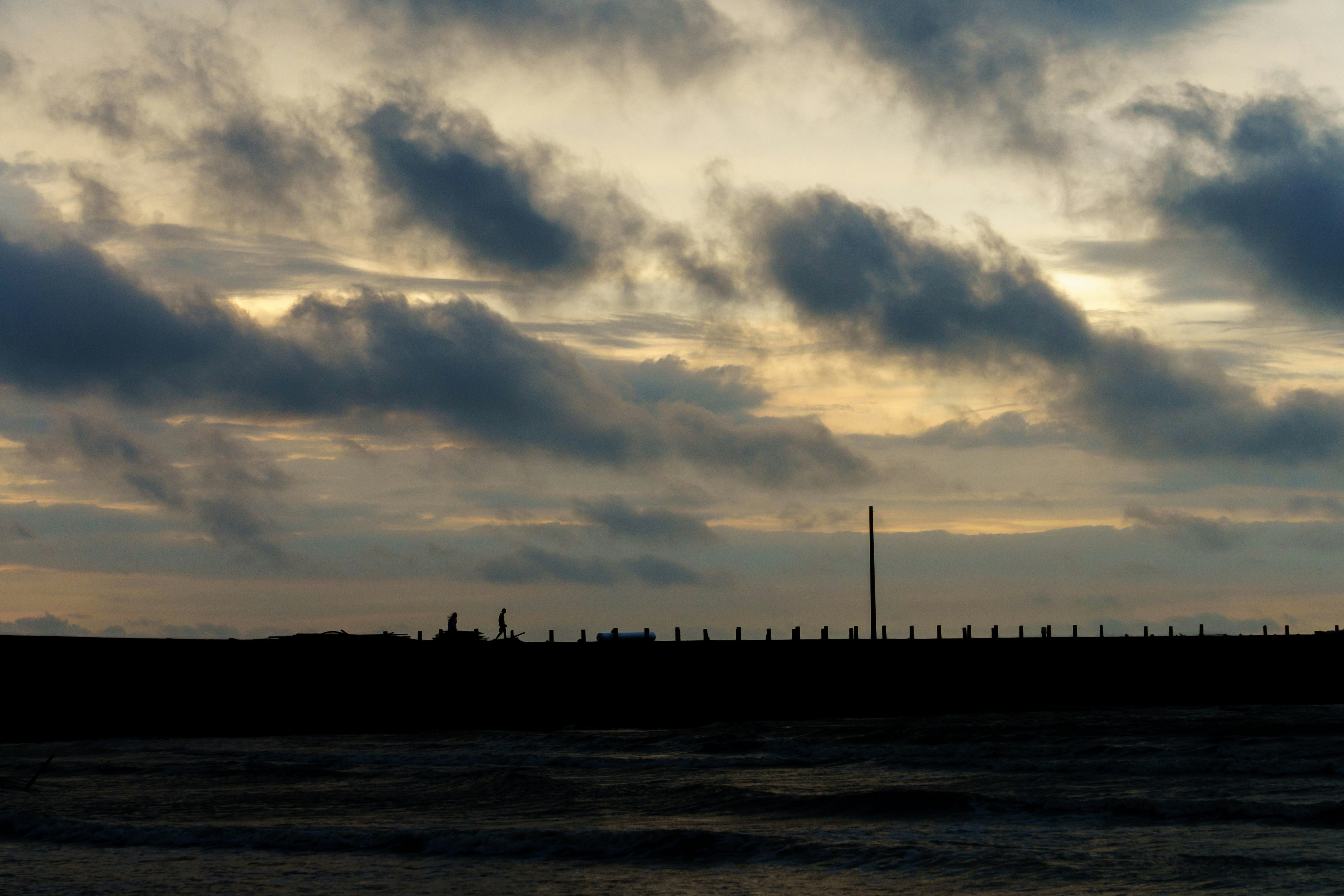Silhouette at Dusk: A Quiet Horizon with Distant Structures