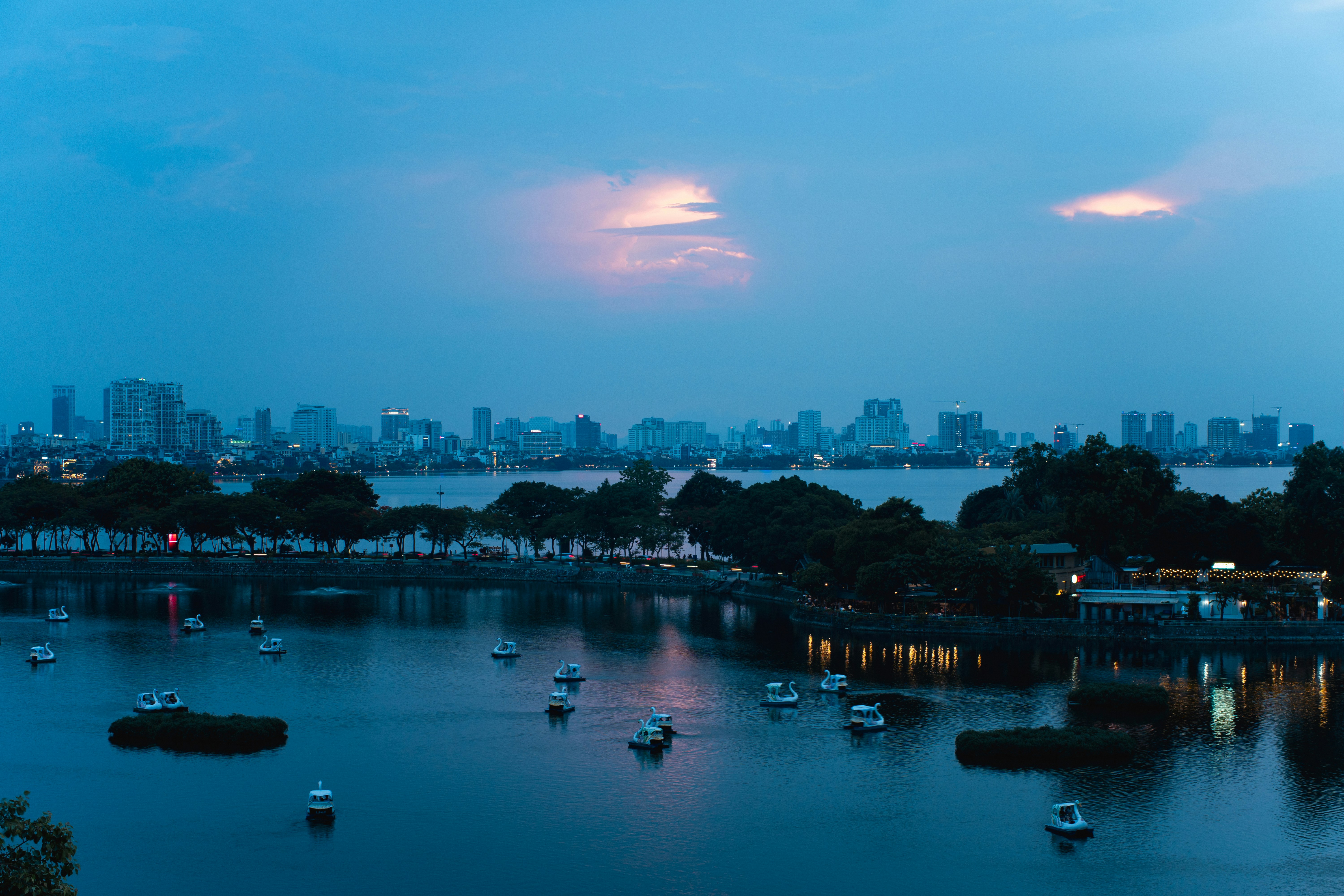 Dusk Over the Marina: City Lights Reflect in Quiet Waters