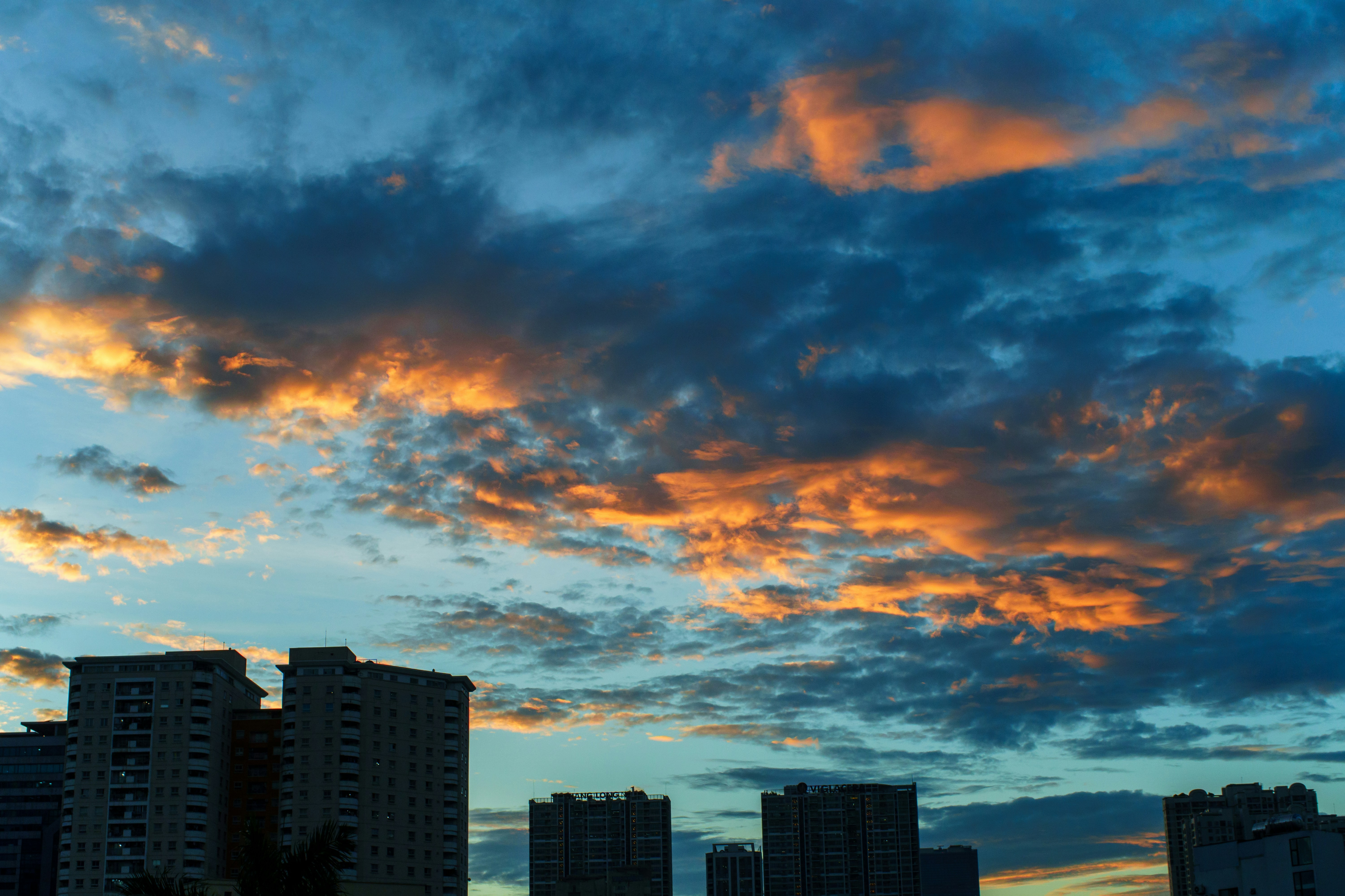 Horizon of Fire: City Silhouettes Beneath a Fiery Sunset