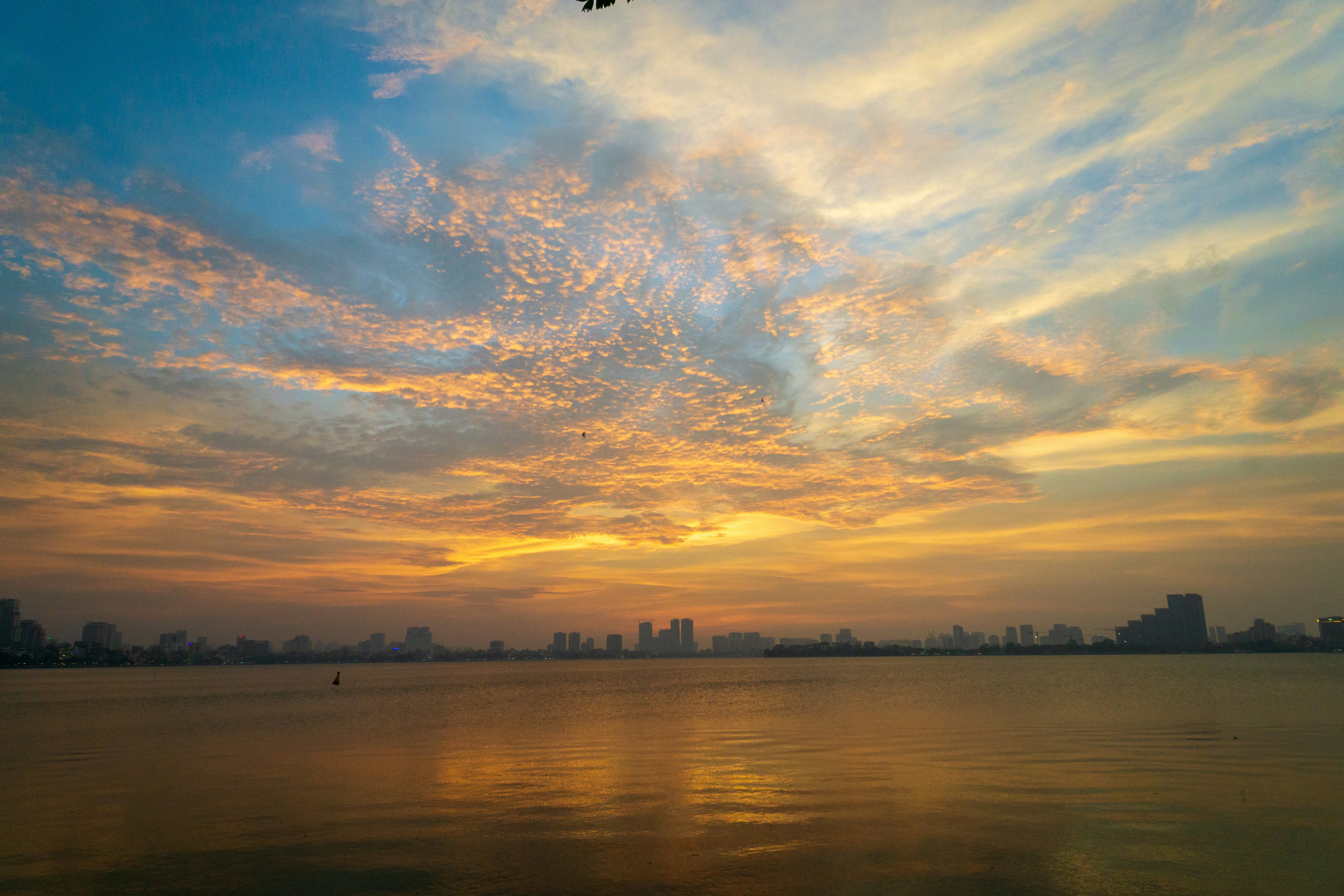 Horizon Fire: A Golden Riverside at Dusk