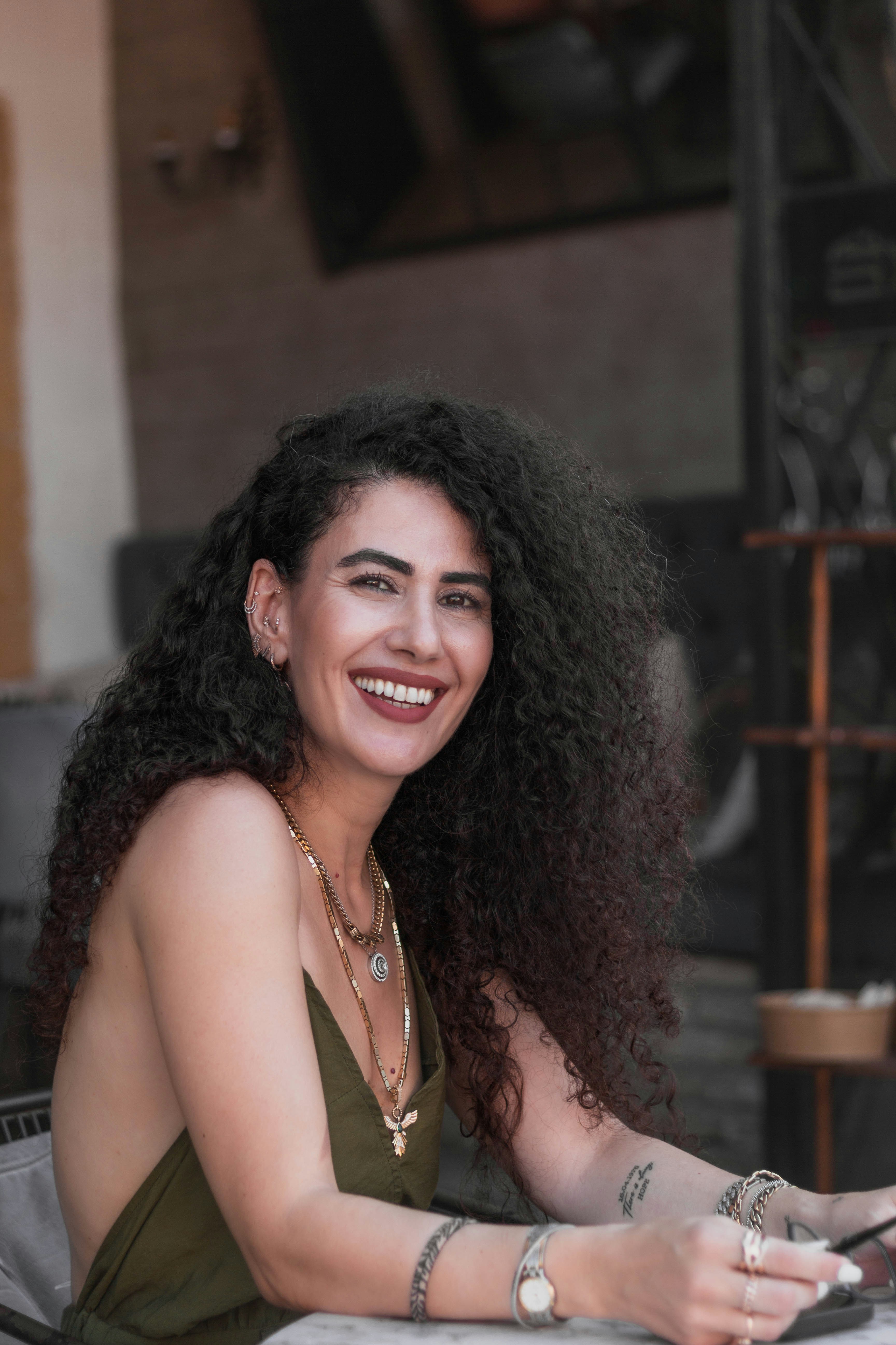 Curled Confident Smile: A Portrait of Grace and Bold Hair