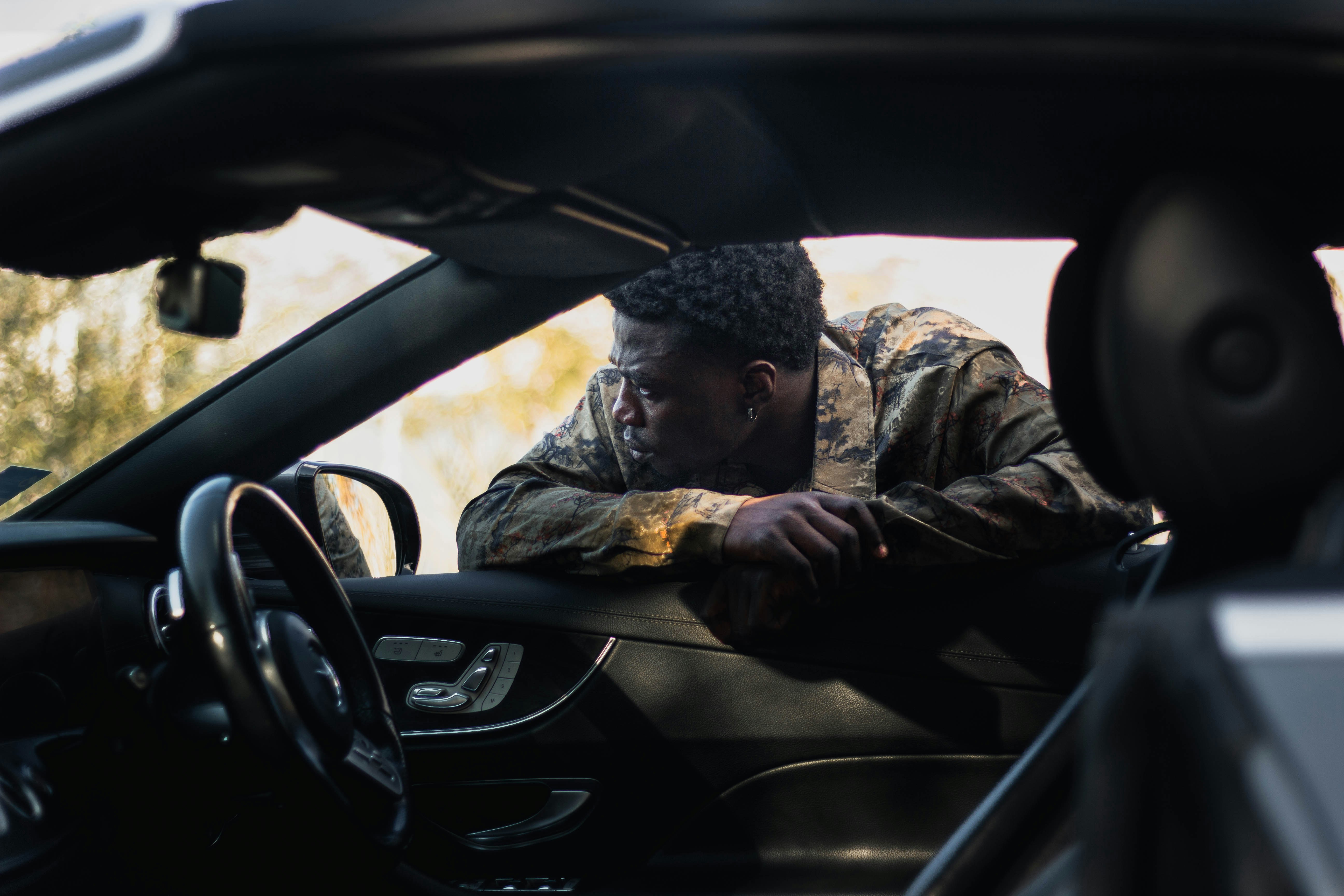 Lean in the Driver's Seat: A Quiet Moment Through the Car Window