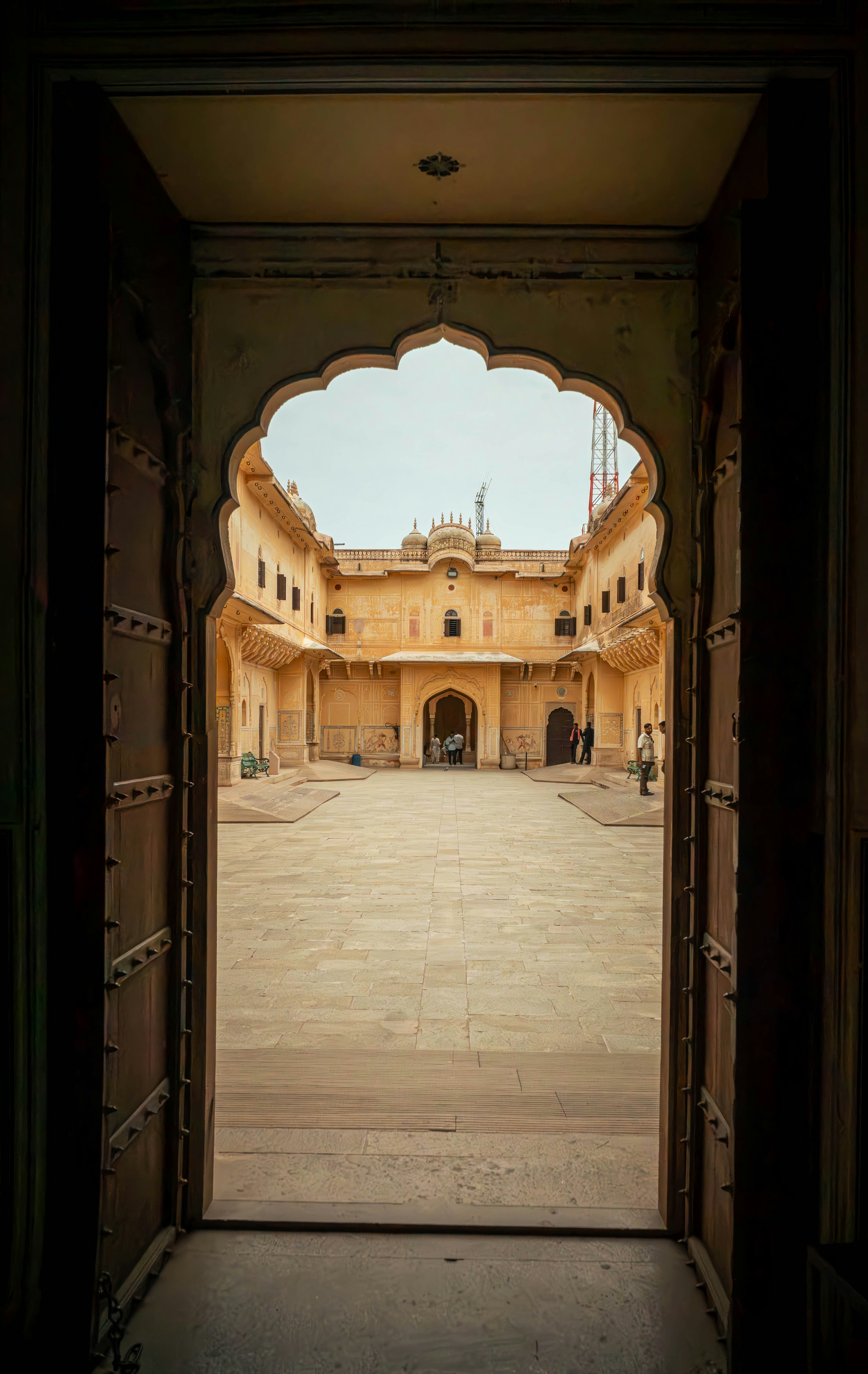 Arched Gateway to a Sunlit Courtyard