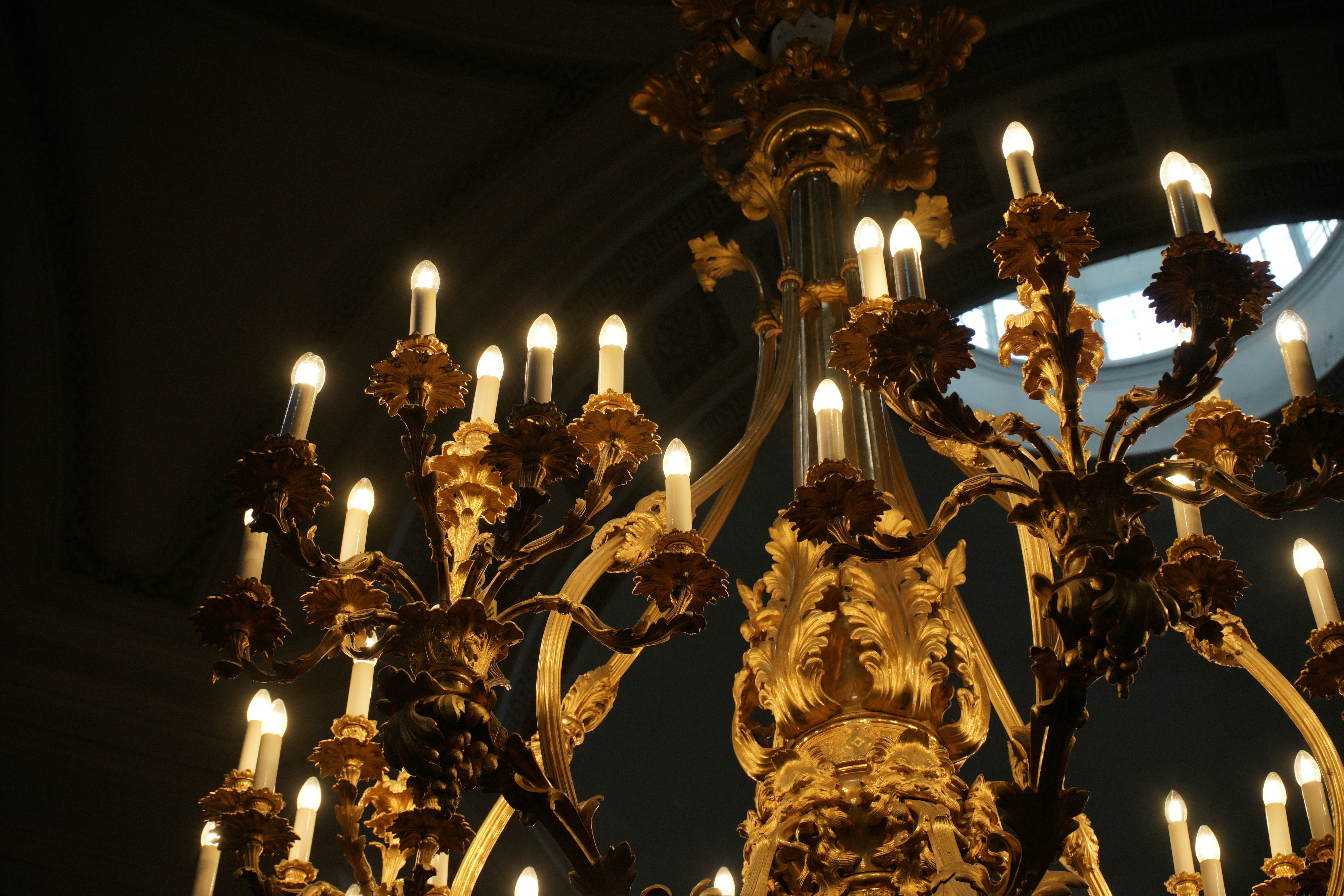 Golden Chandeliers Ablaze: An Intimate Glimpse of Baroque Luminescence