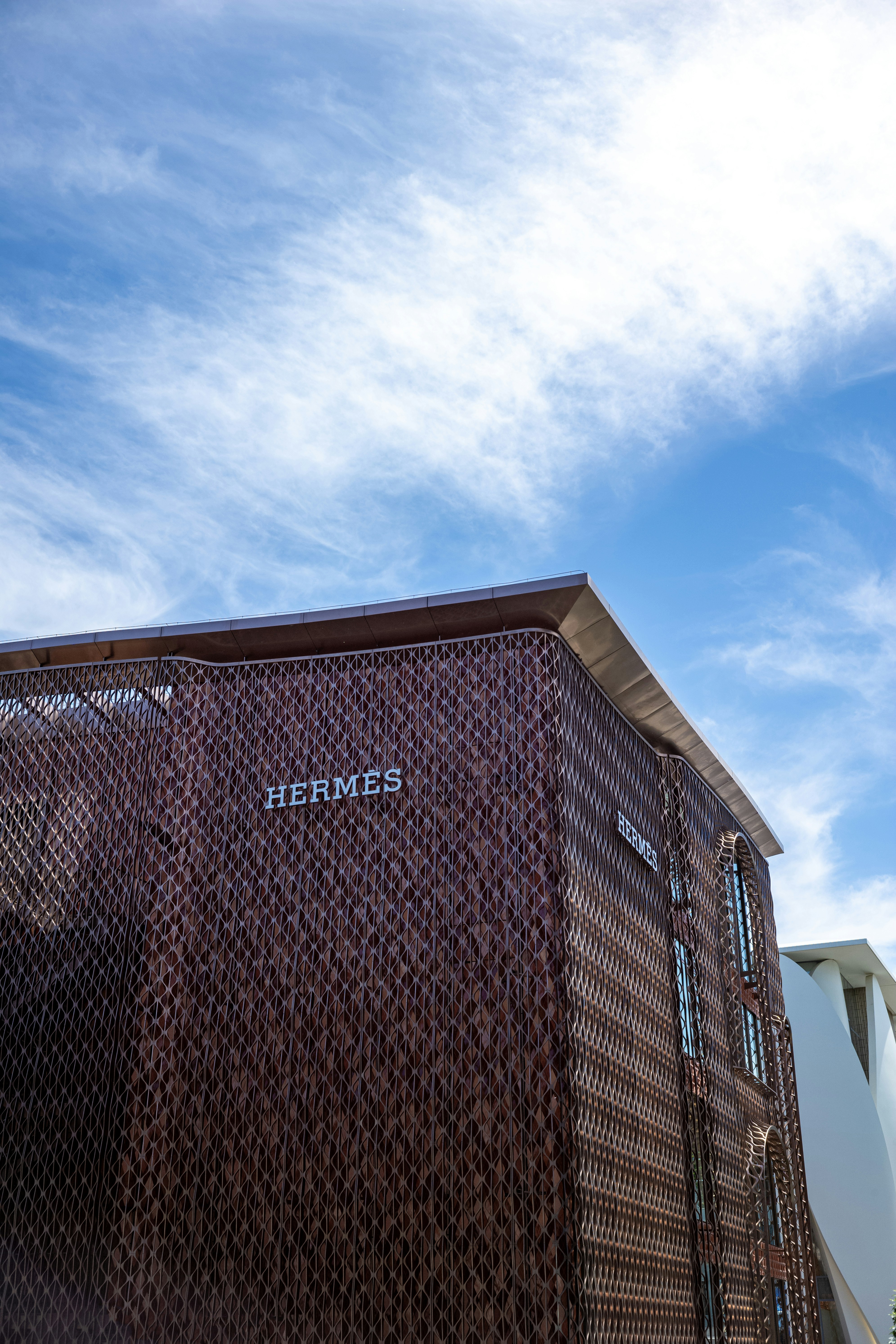 Hermes Facade: Lattice Architecture Against a Bright Sky