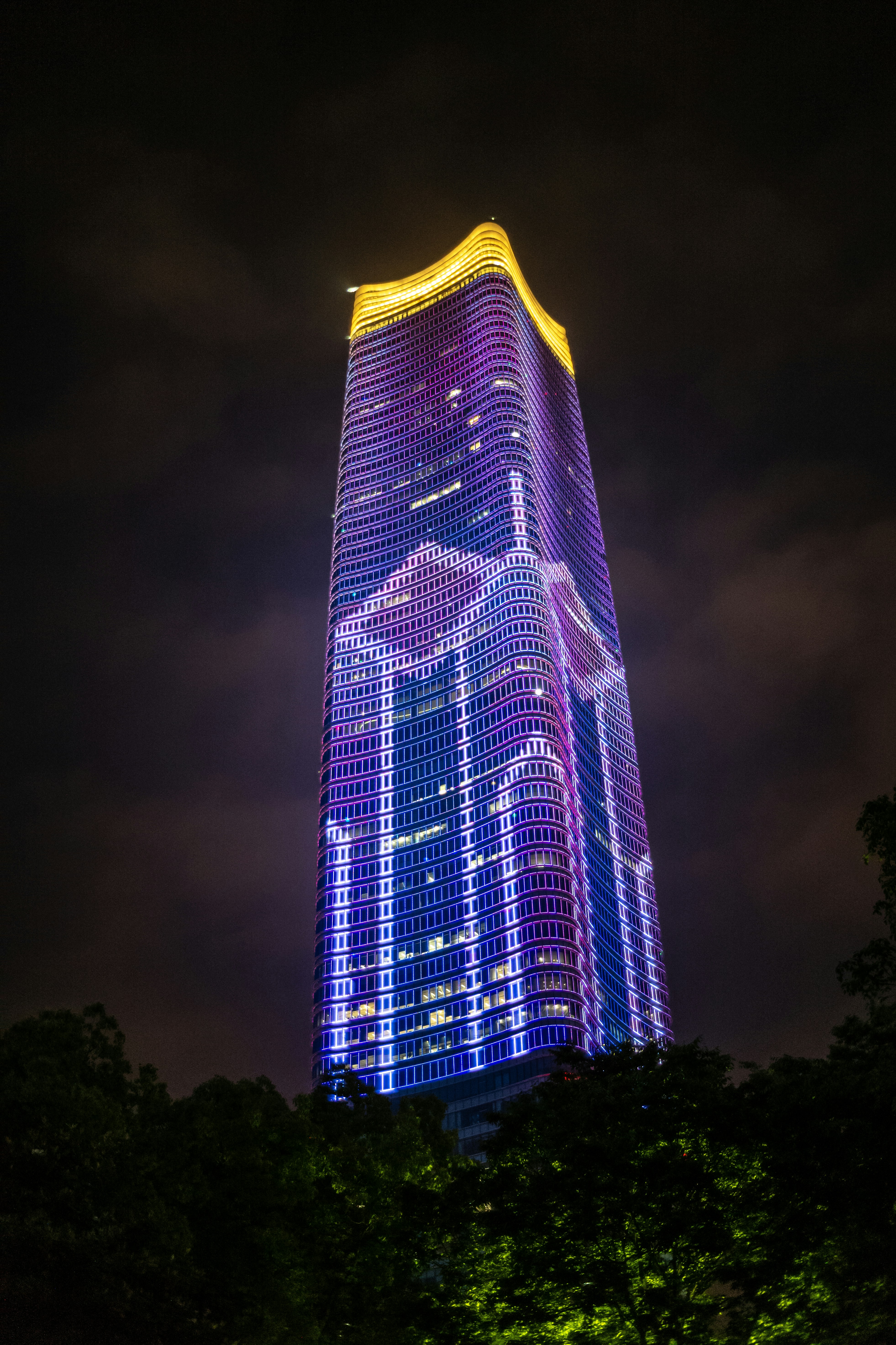 Neon-tipped Skyweight: A Moonlit Tower Illuminated in Violet