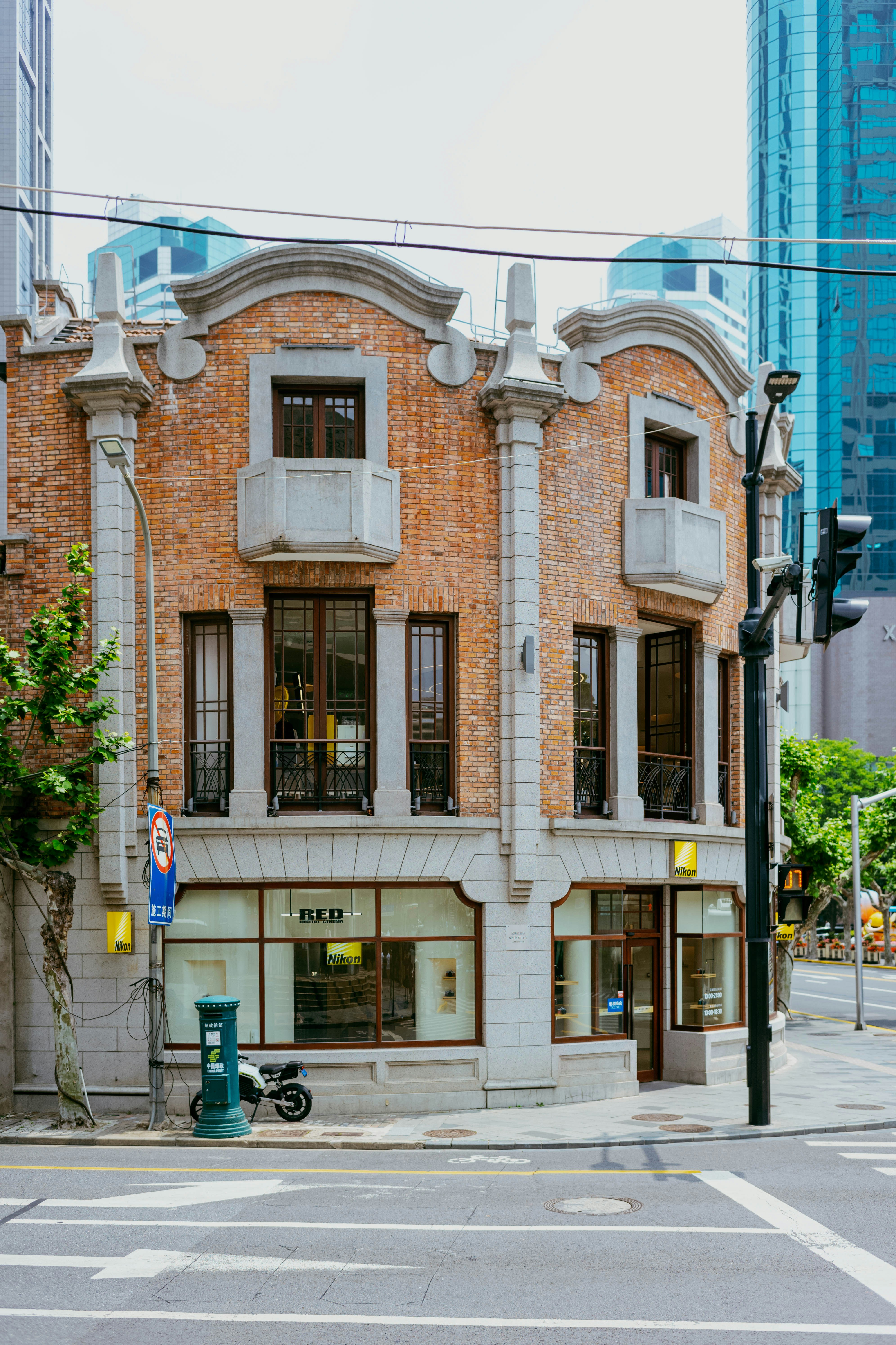 Brick Corner Convergence: Vintage Facade Meets Modern Skylines