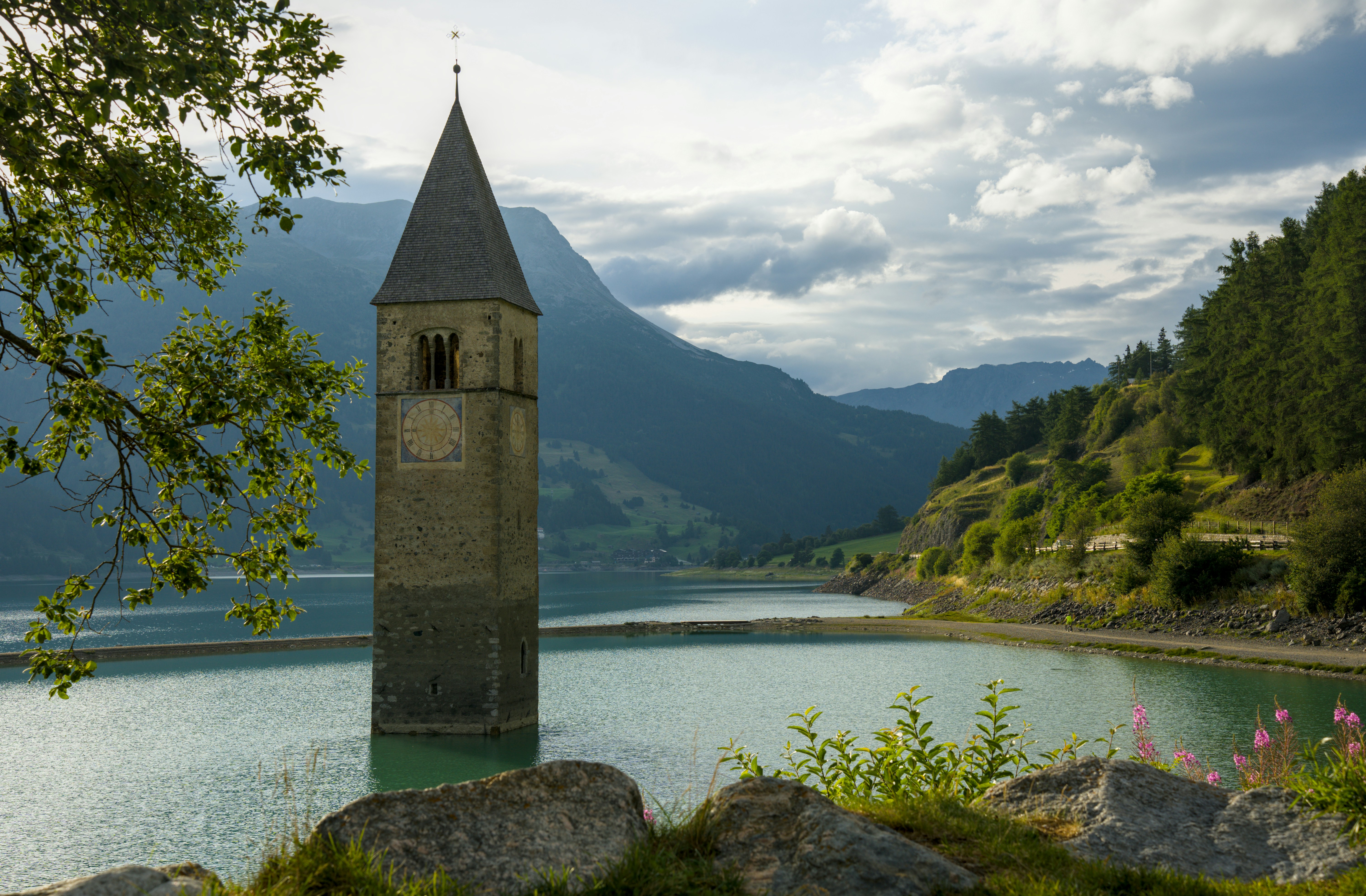 Tower in the Lake: A Stone Bell Tower Rising from Still Water