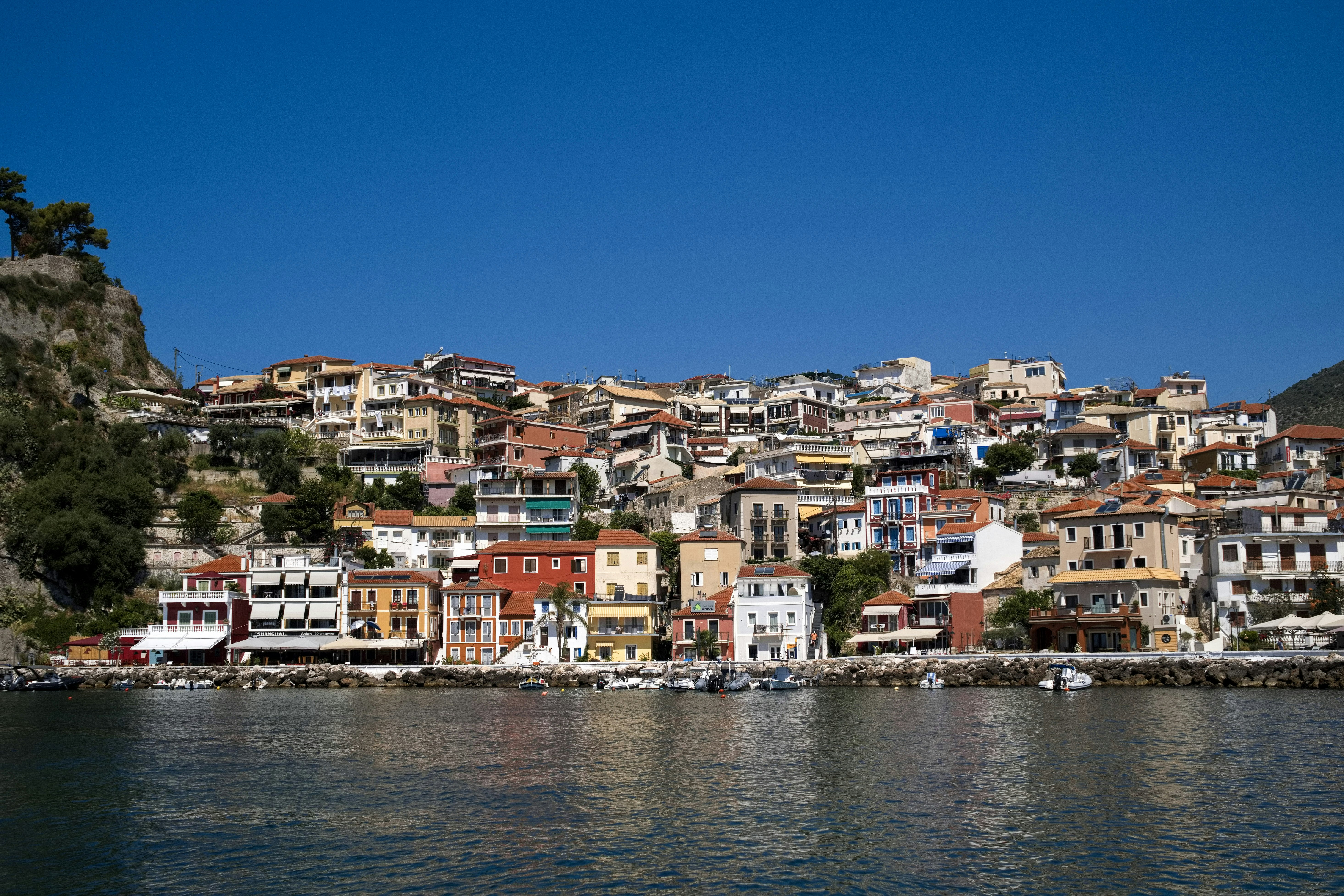 Coastal Village Strata: Colorful Houses Stack Along the Waterfront