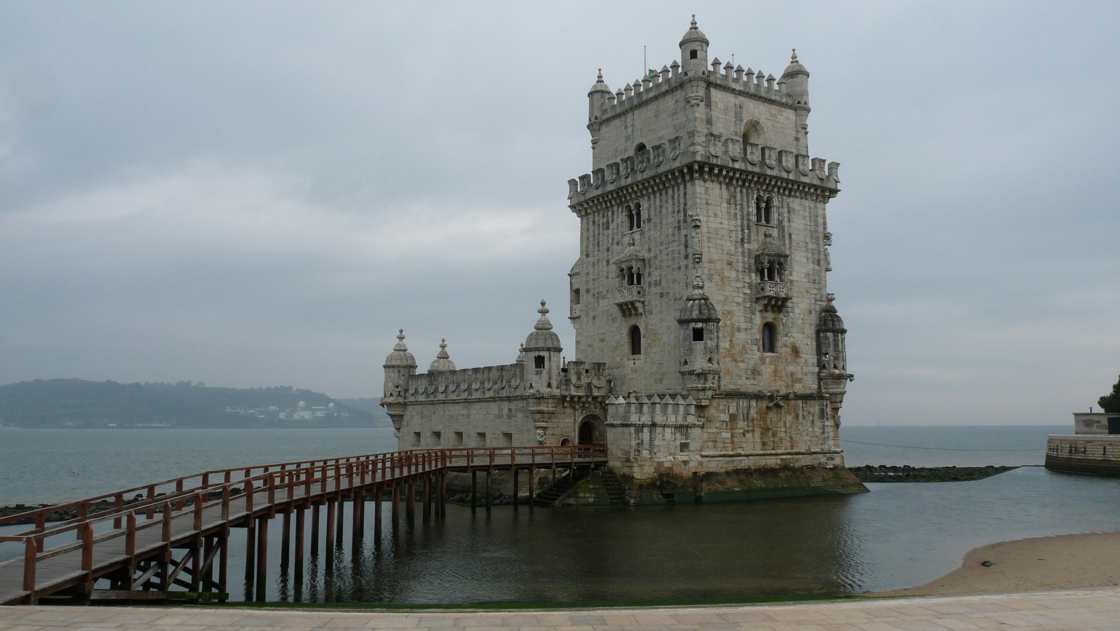 Towering Sentinels: The Fortress of Belém Rising from the Coastal Mist