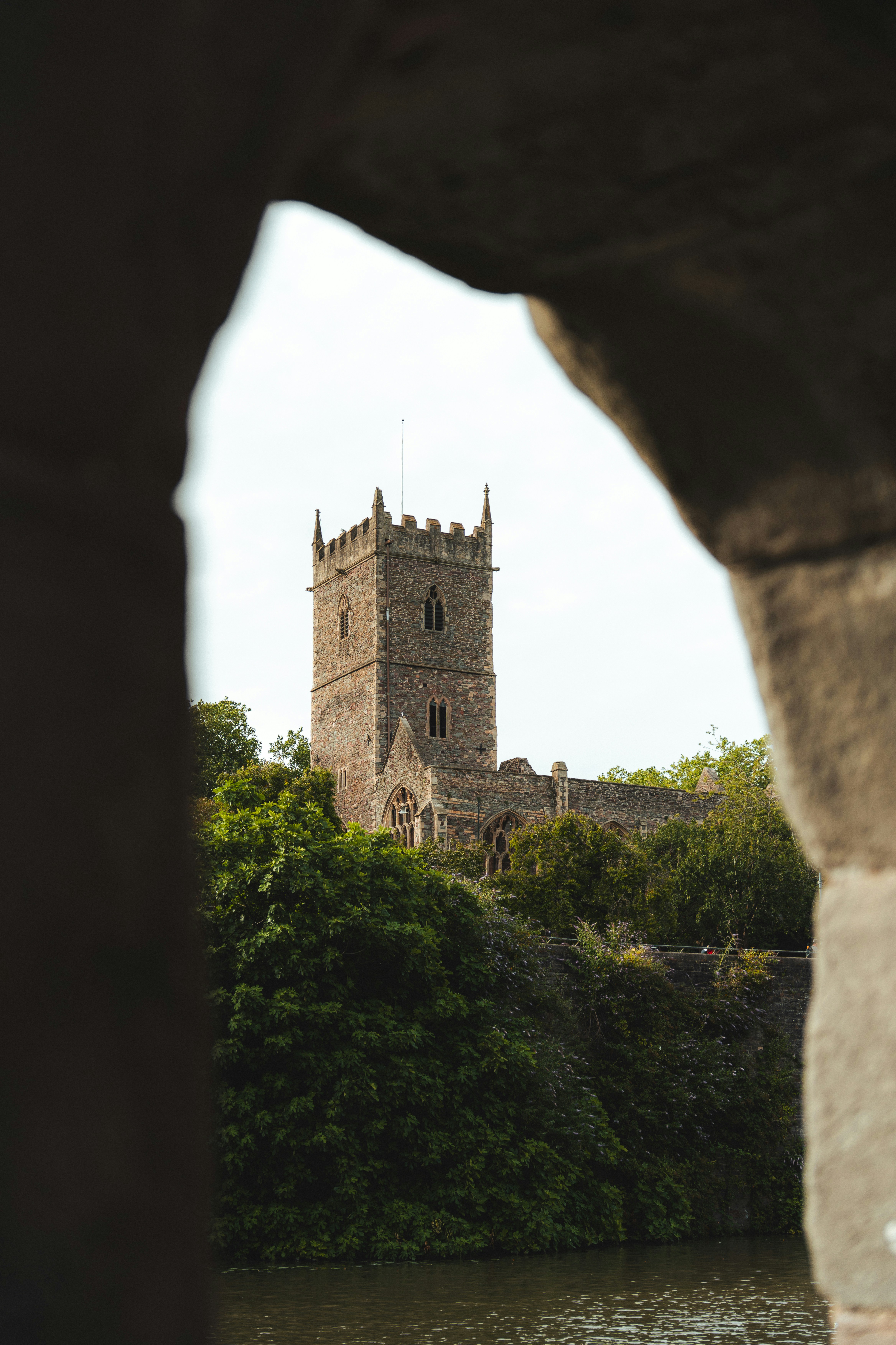Castle Tower Framed by Arch: A View Through Stone Shadows