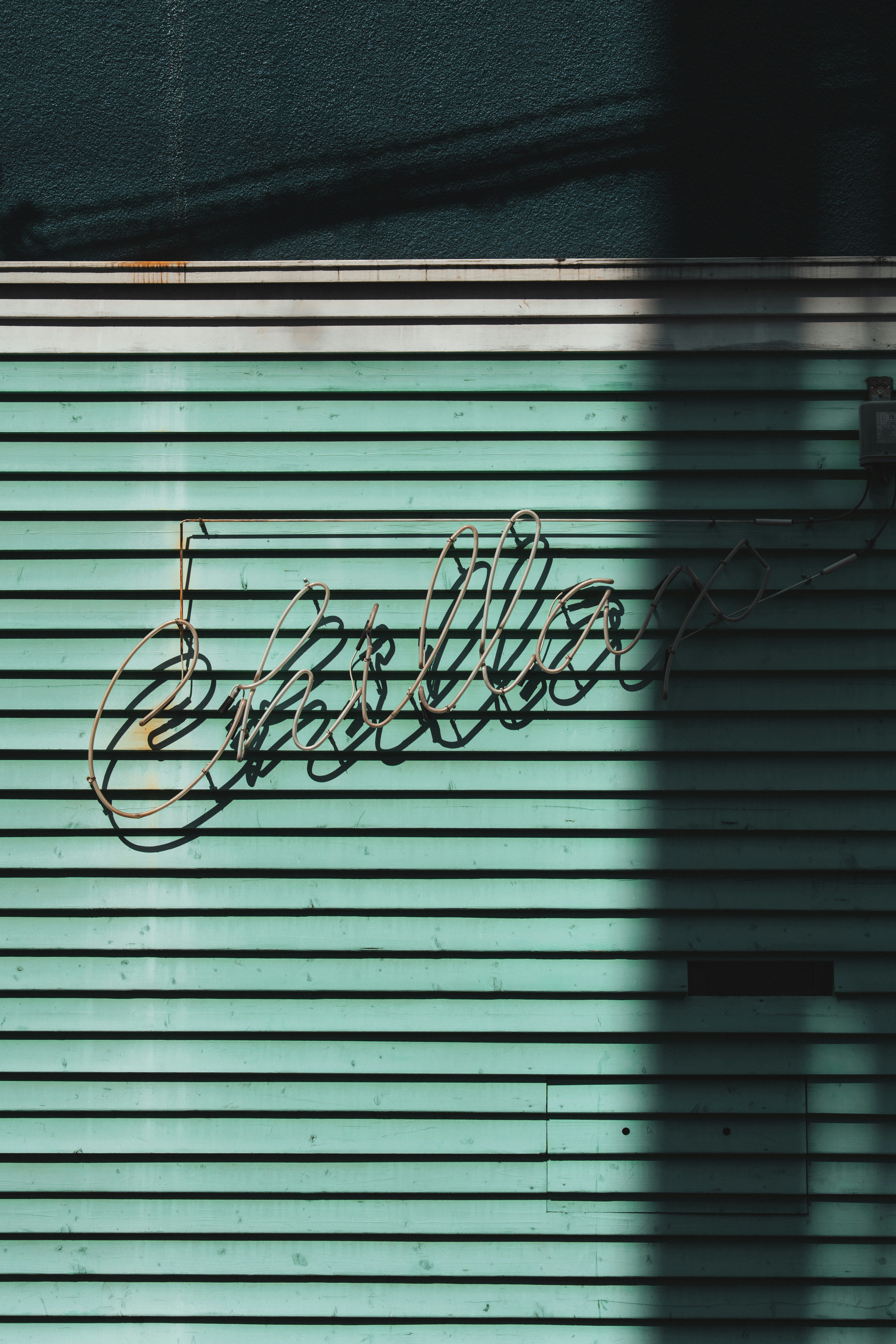 Neon Script in the Sunlit Slats