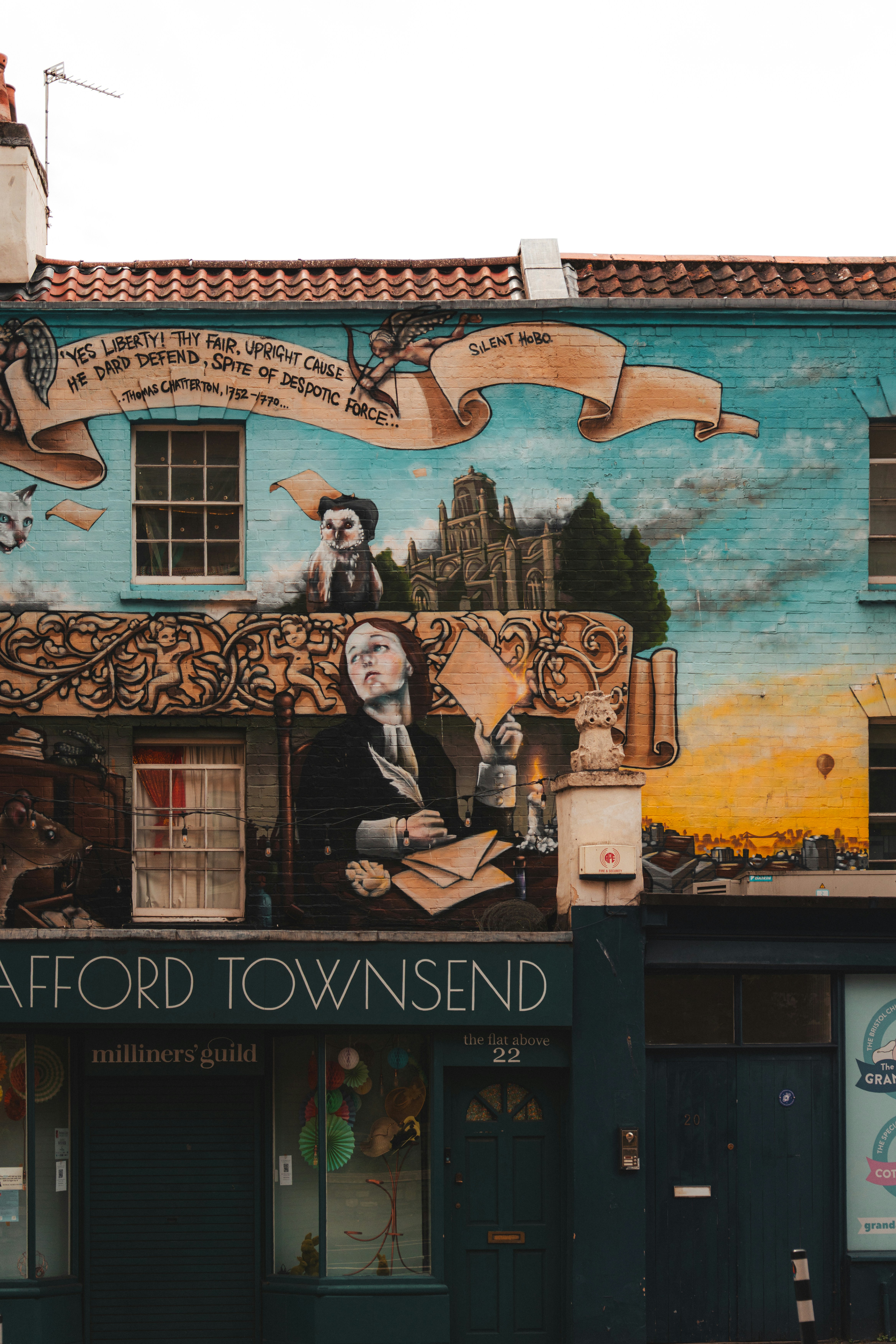 Mural of Minds and Machinery Over a Town Gate