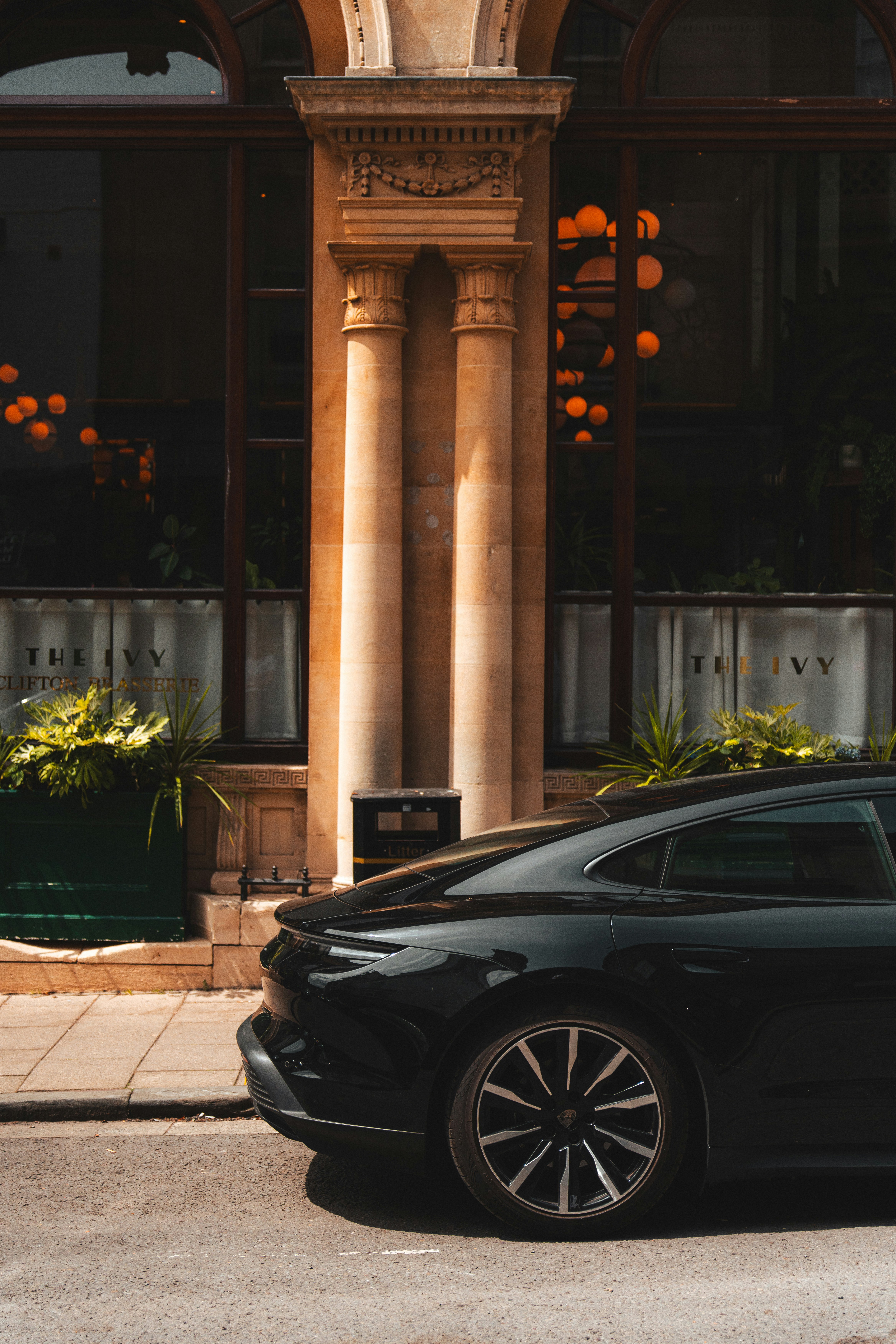 Bottom-Front Car and Ornate Facade: A Street-Level Portrait of Urban Quiet