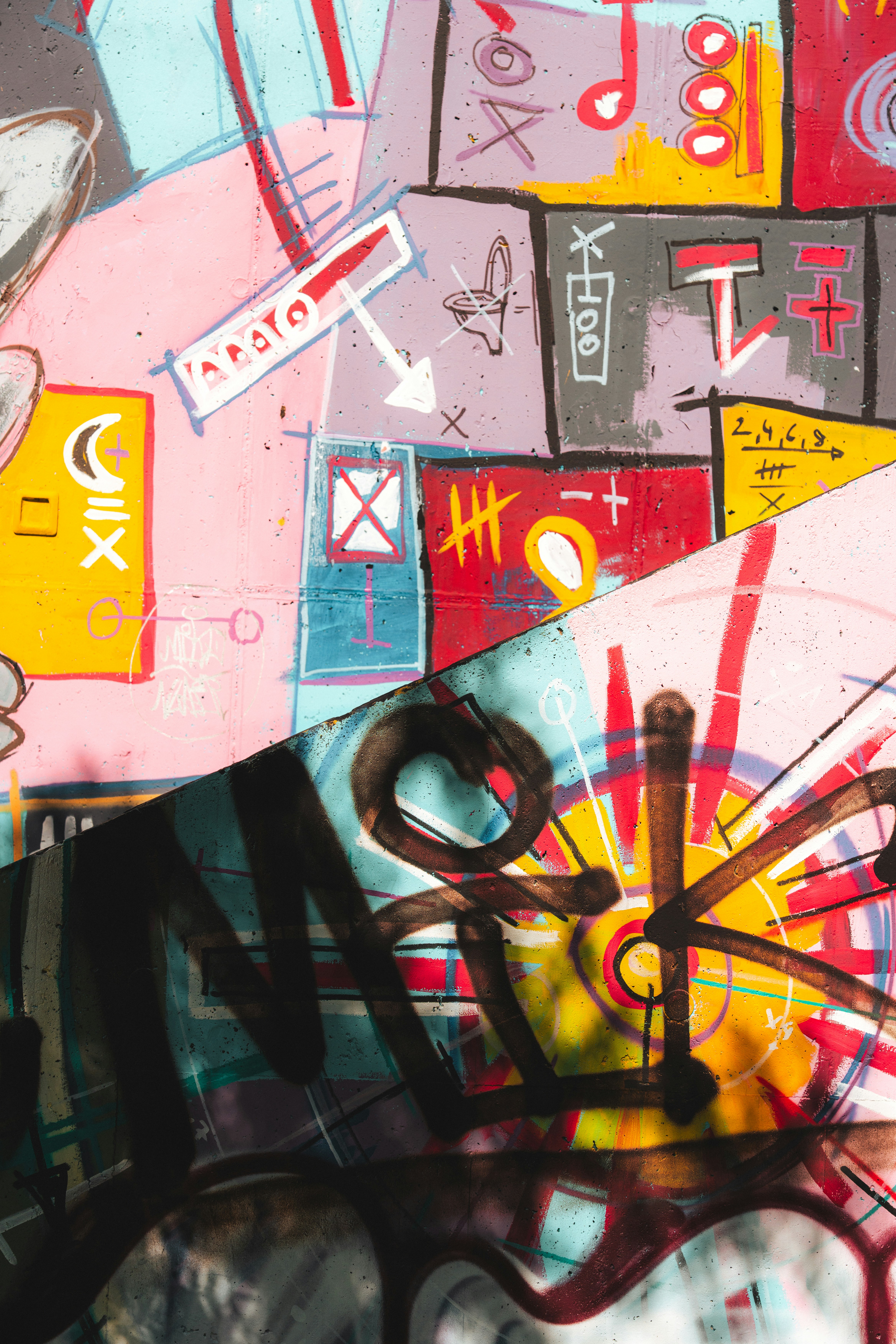 Urban Mosaic: A Burst of Color and Symbols Across the Wall