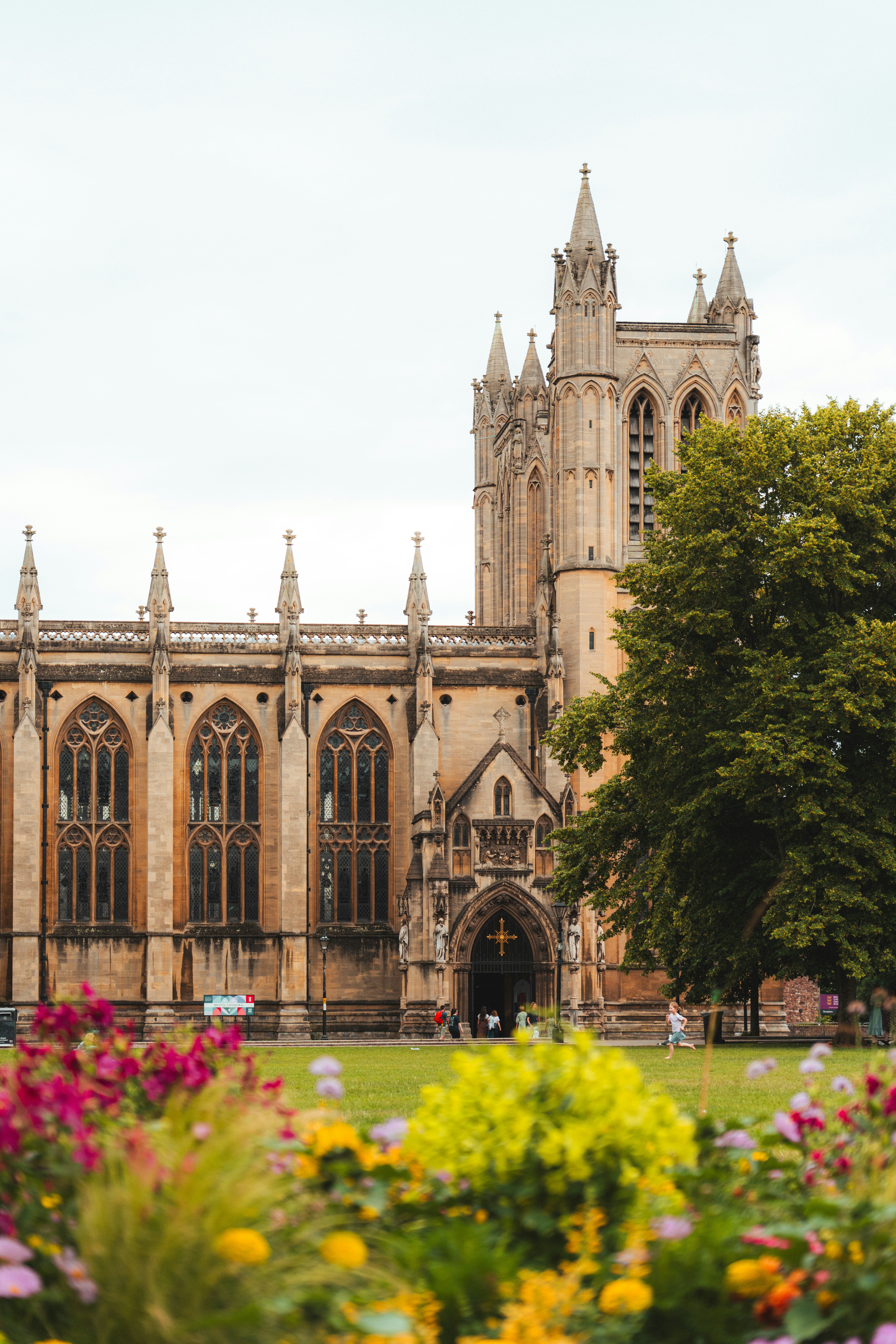 Cathedral in Bloom: A Stone Facade Framed by Garden Colors